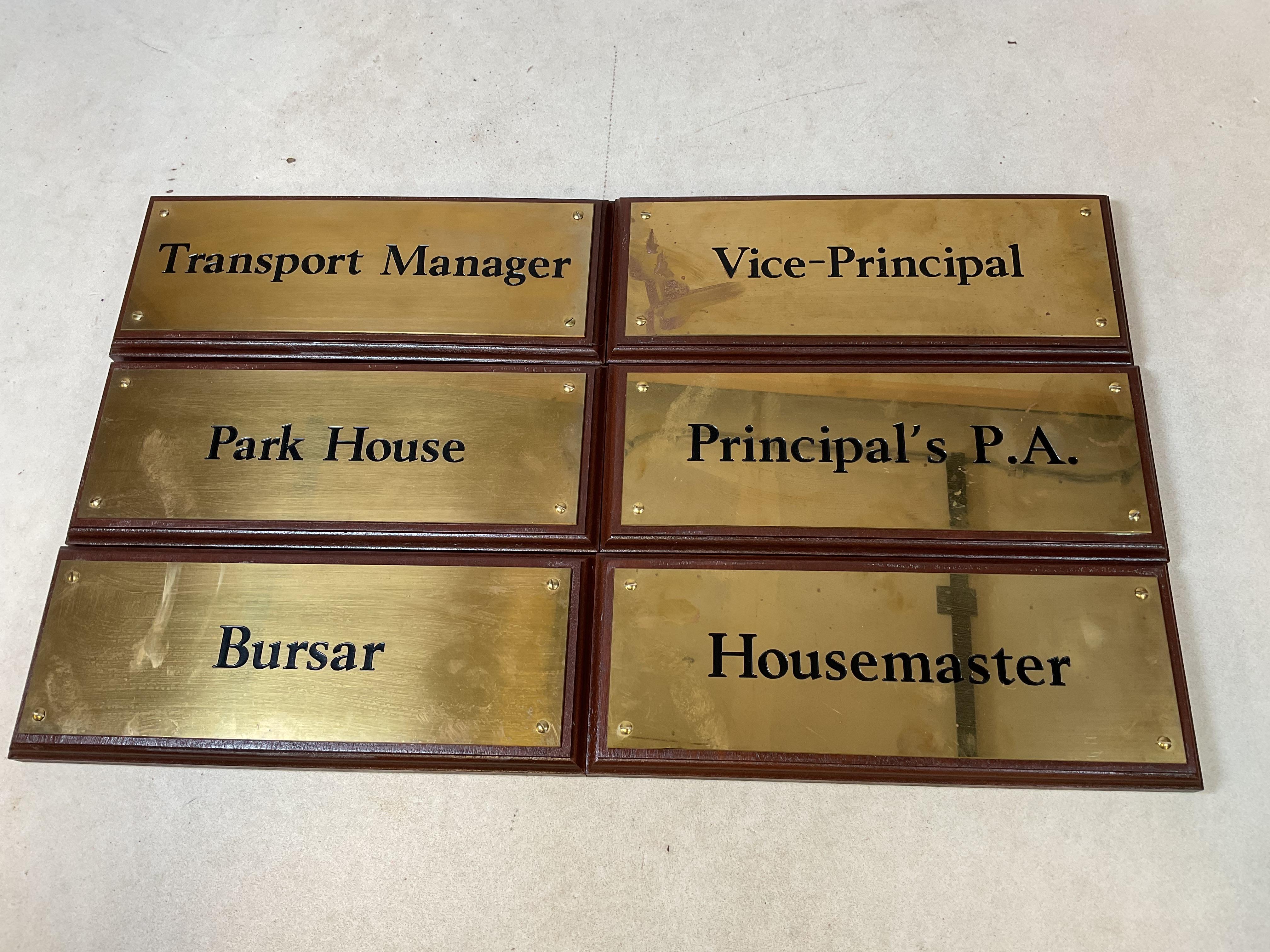 Lot 35 - Six engraved brass plaques on wooden plinths,