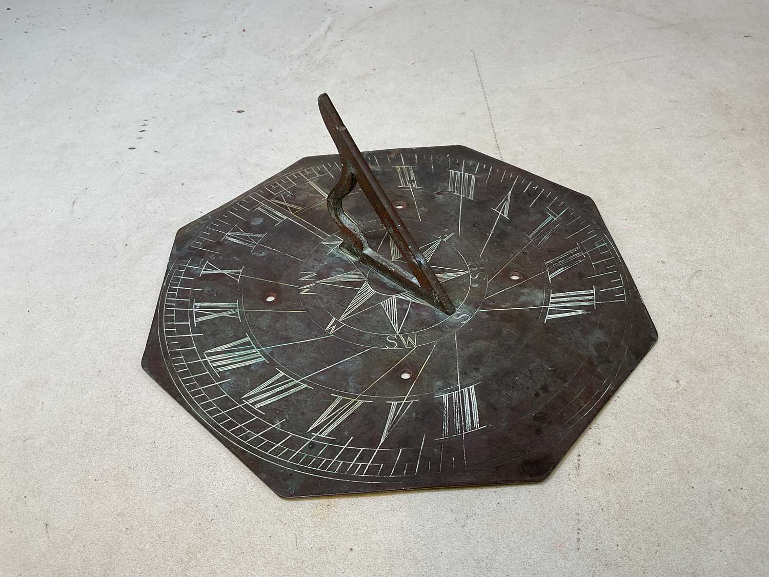 Lot 4 - A 19th century octagonal copper sun dial with