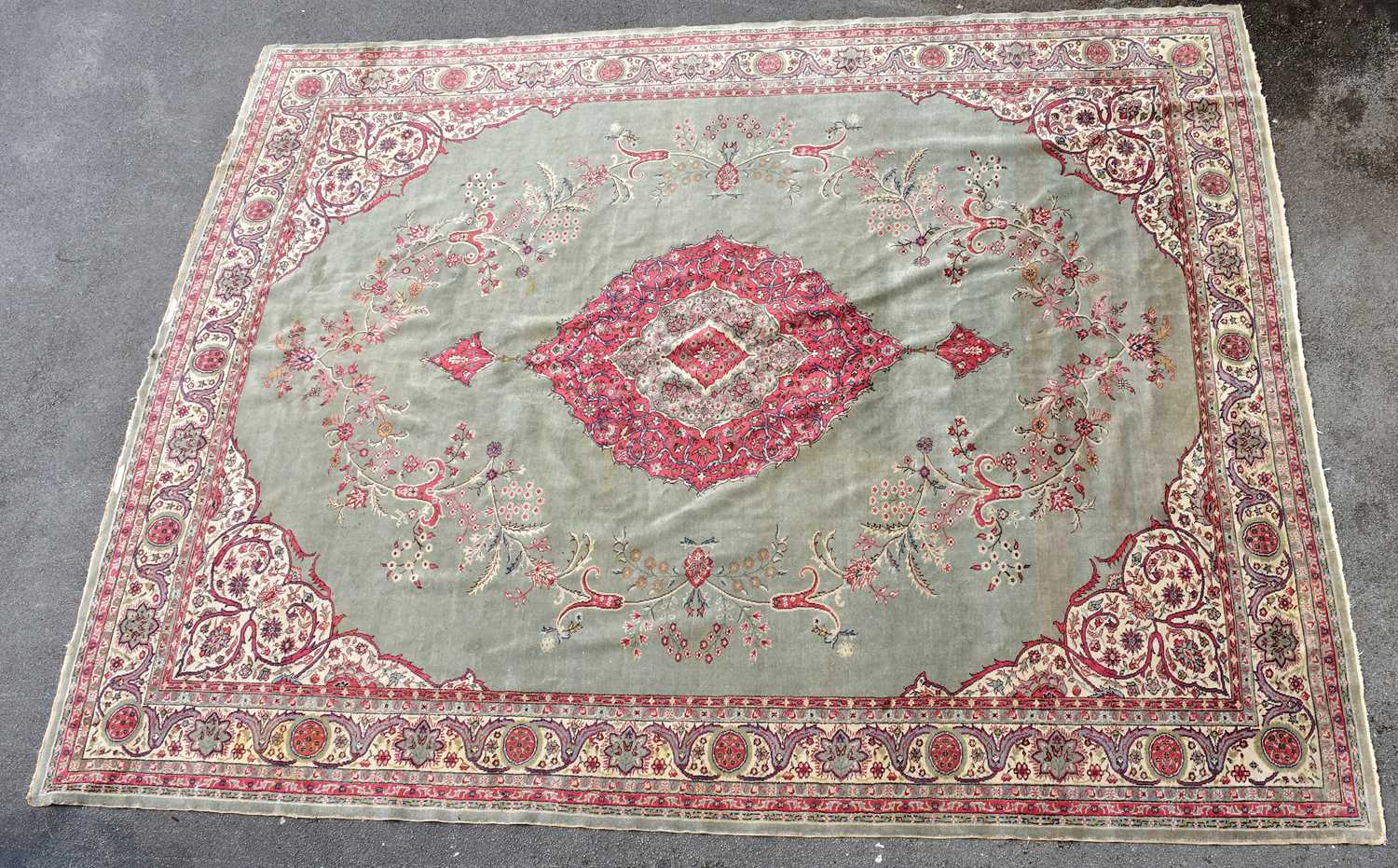 Lot 2363 - A large Eastern style carpet, centrally