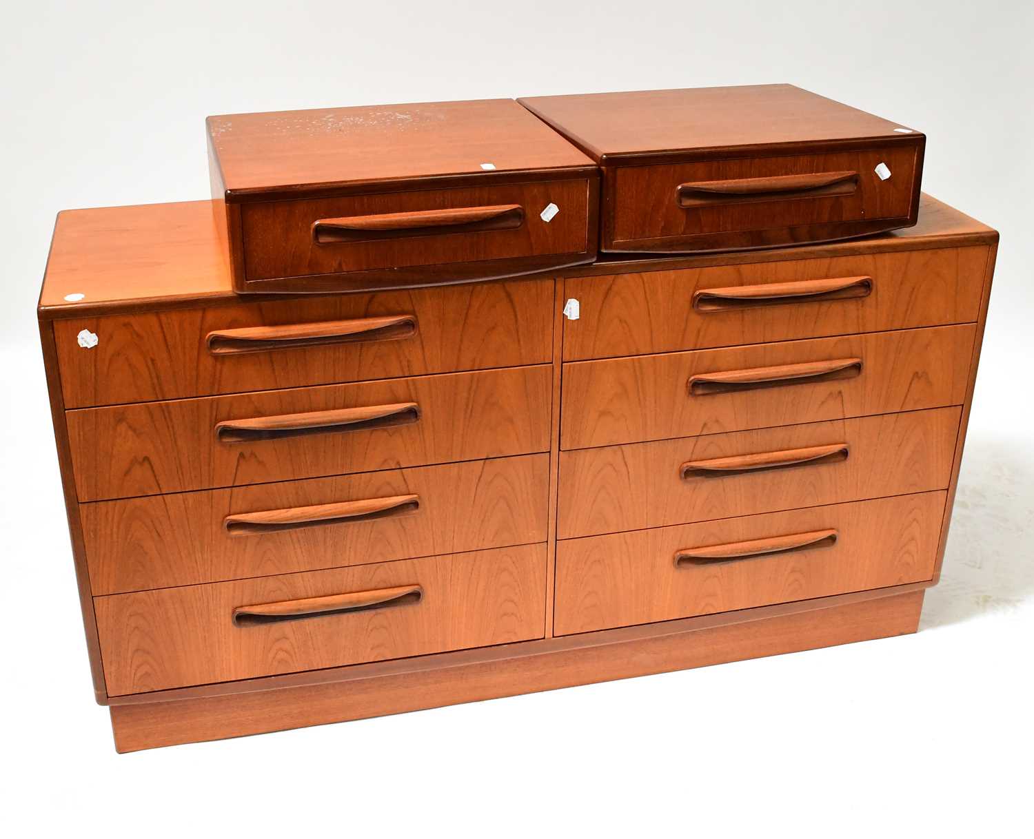 Lot 7 - G-PLAN; a teak chest of eight long drawers,