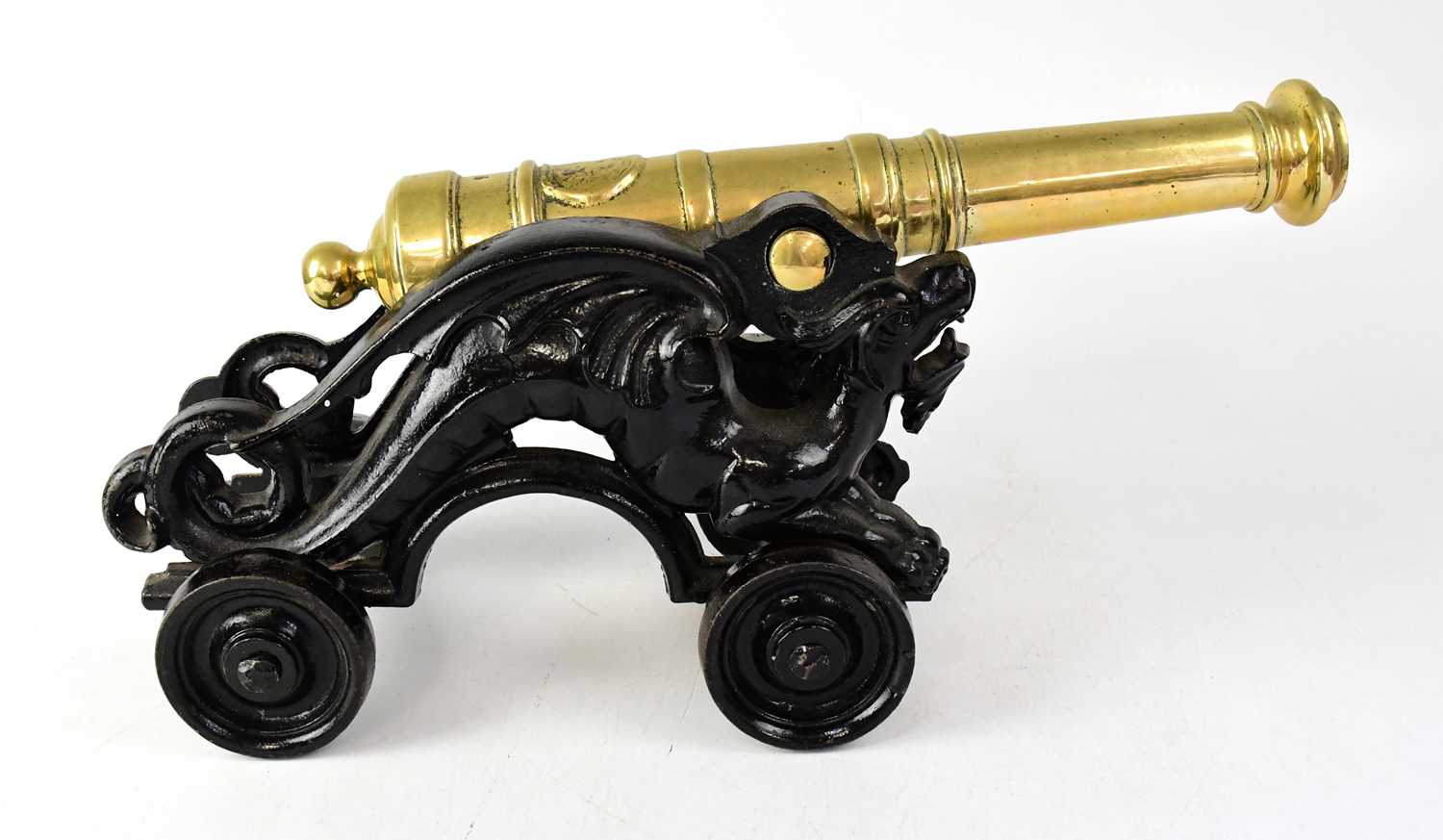 Lot 342 - A brass and cast iron table cannon with