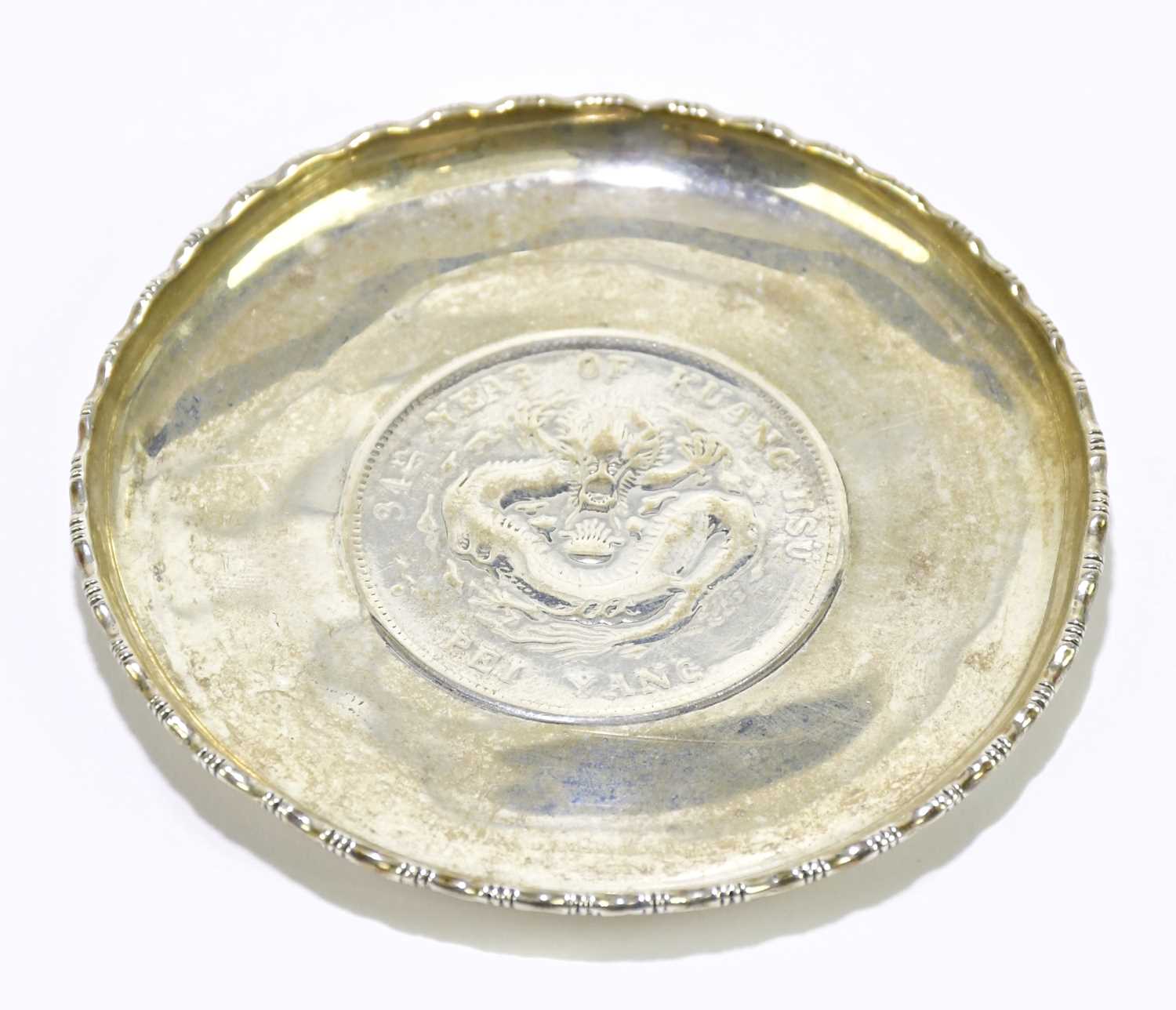 Lot 1361 - A Chinese silver pin dish with cast rim