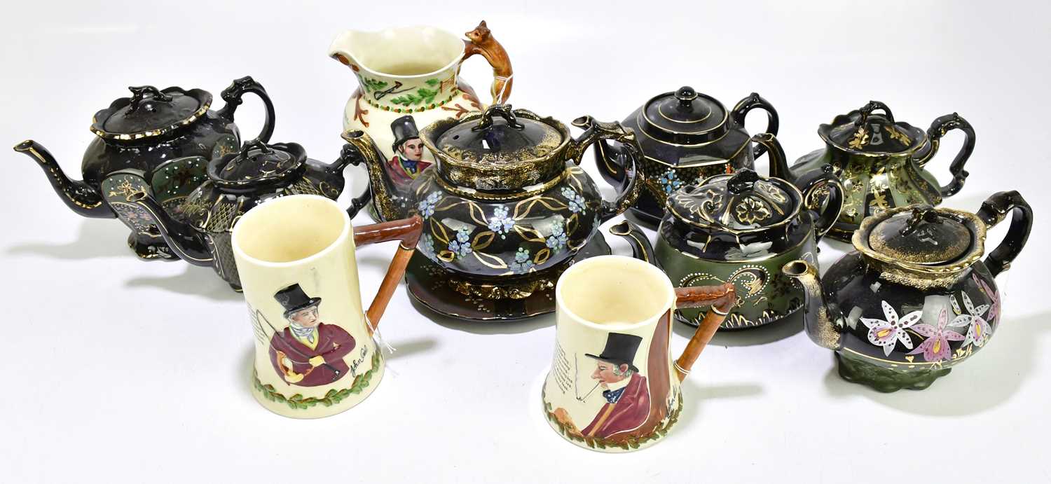 Lot 1524 - A collection of seven Jackfield teapots,