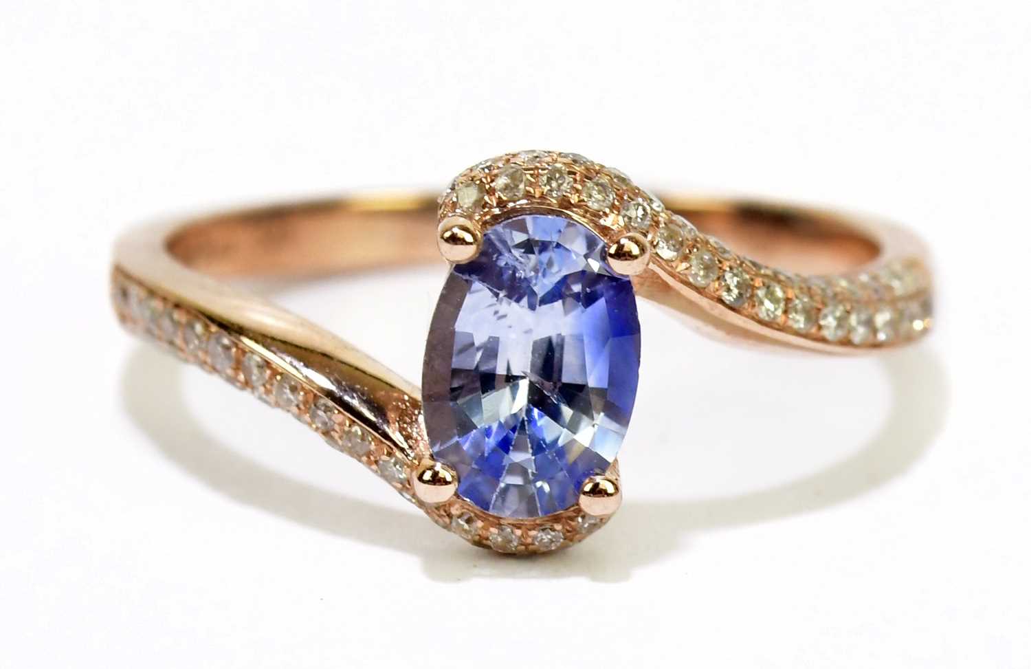 Lot 72 - A 14ct rose gold sapphire and diamond ring,