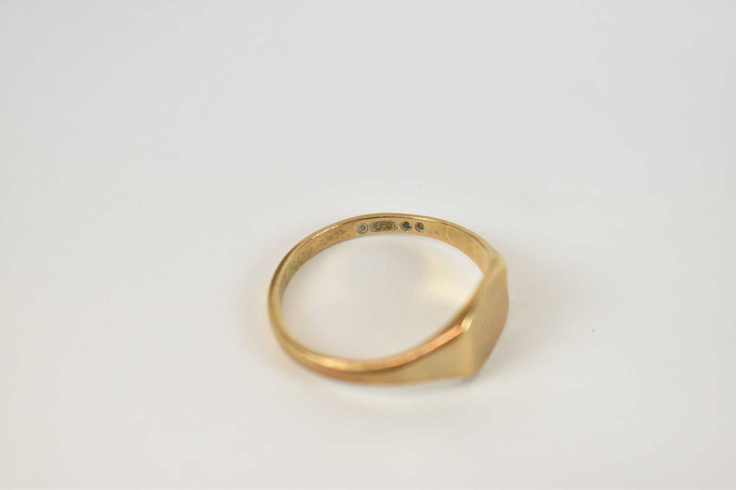 Lot 754 - A 9ct yellow gold gentleman's signet ring, a