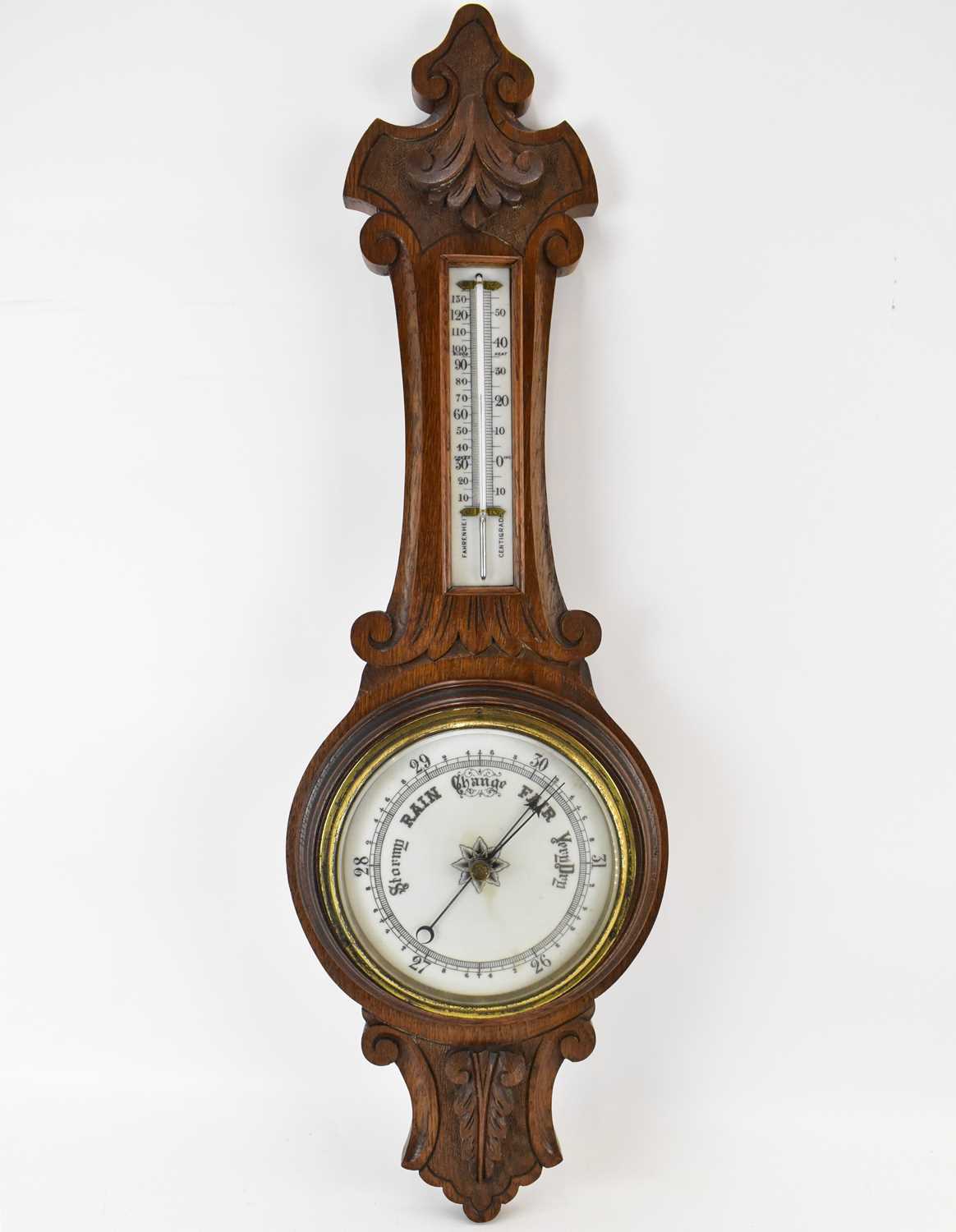 Lot 161 - An early 20th century oak cased barometer of