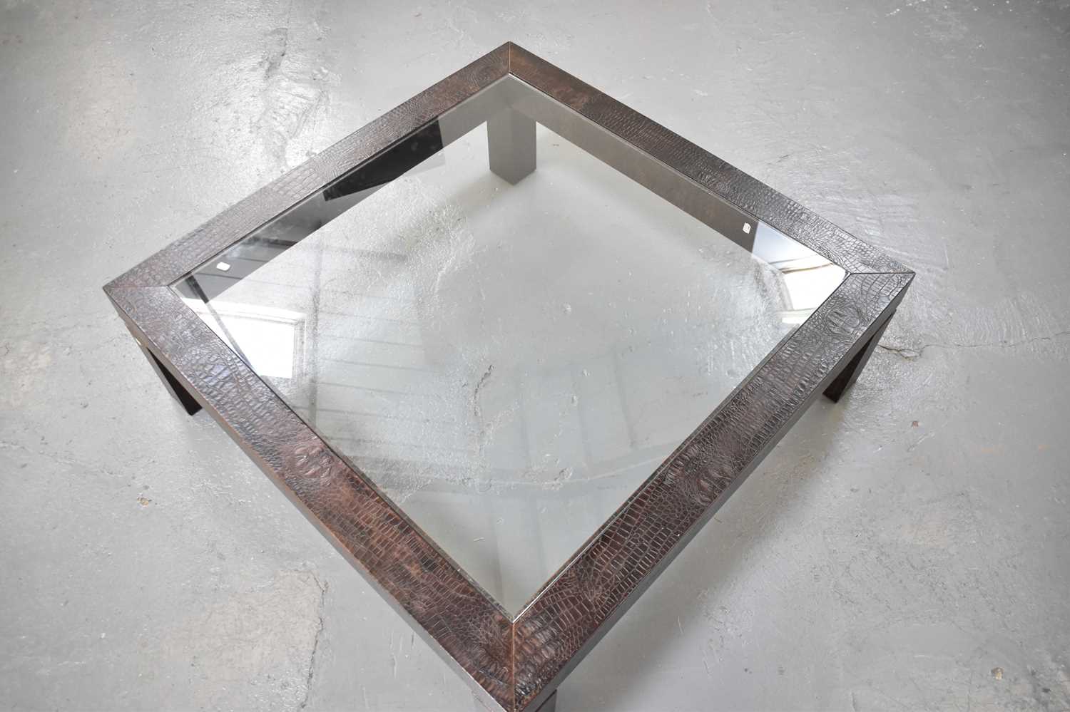 Lot 102 - A large modern crocodile effect coffee table