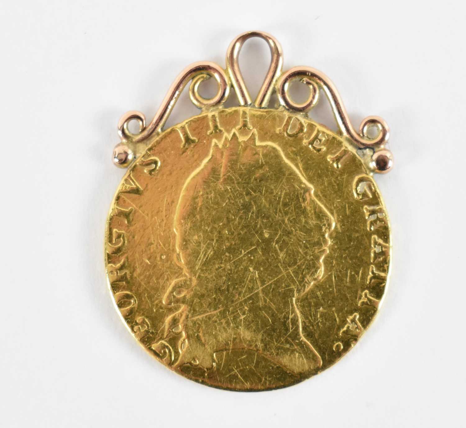 Lot 823 - A George III 1799 spade guinea, mounted as a
