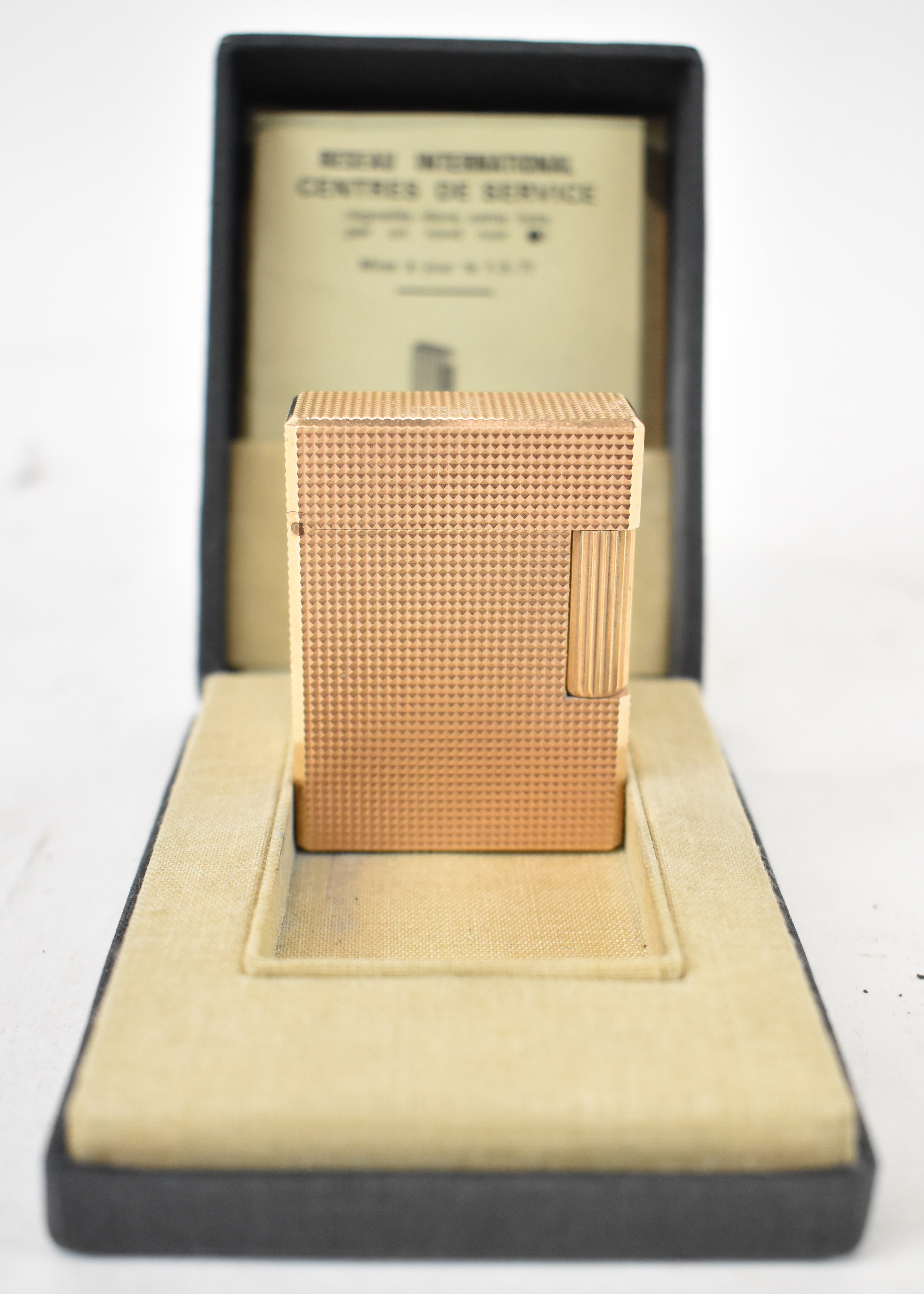 Lot 271 - ST DUPONT; a gold plated gas lighter, in