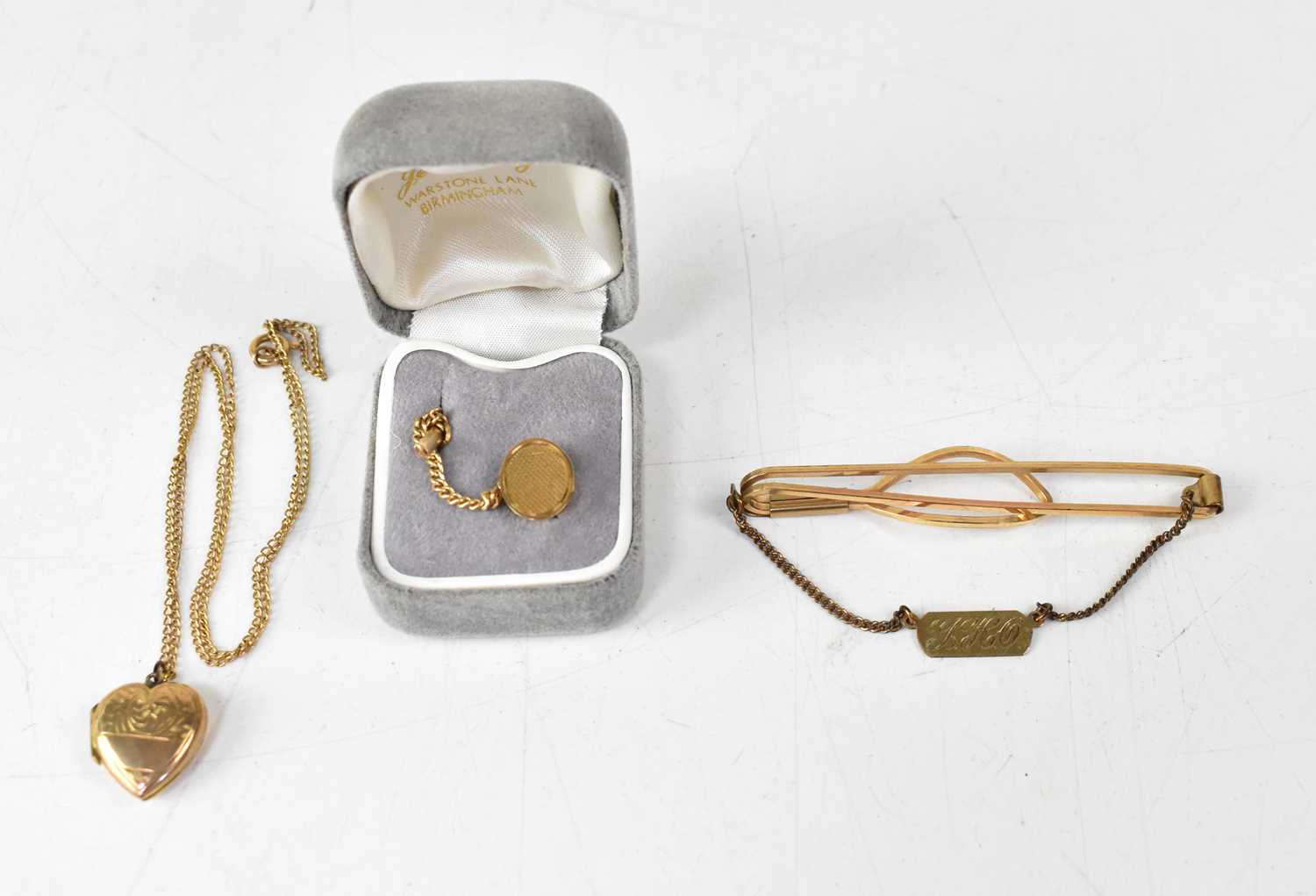 Lot 1088 - A 9ct yellow gold locket on dainty chain, a