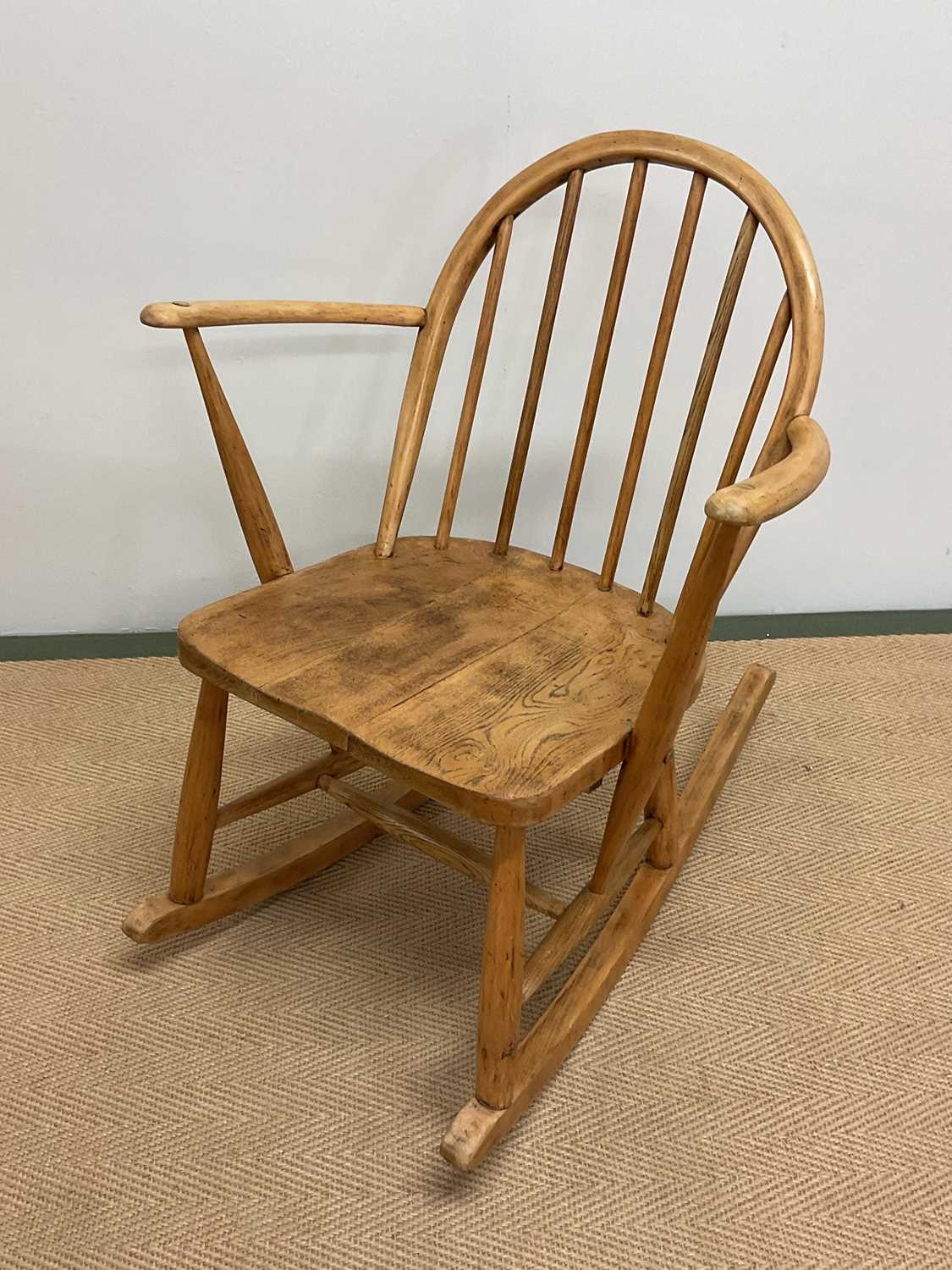 Lot 456 - ERCOL; a small stick back elbow rocking