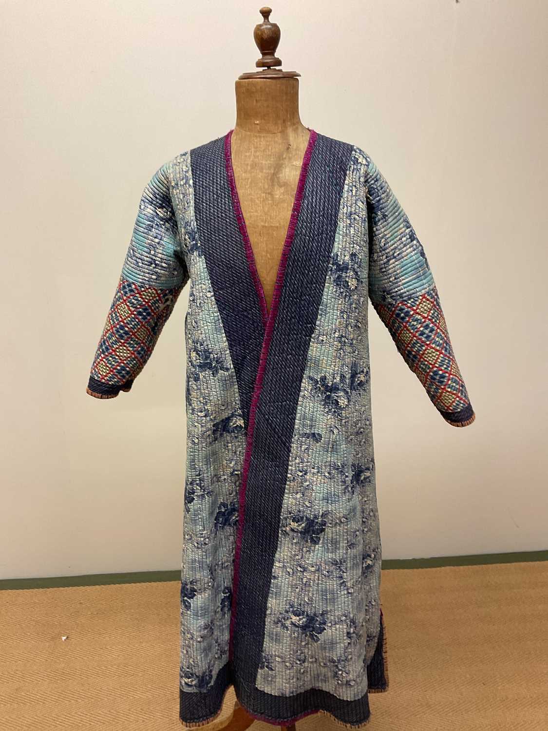 Lot 129 - A traditional coat form