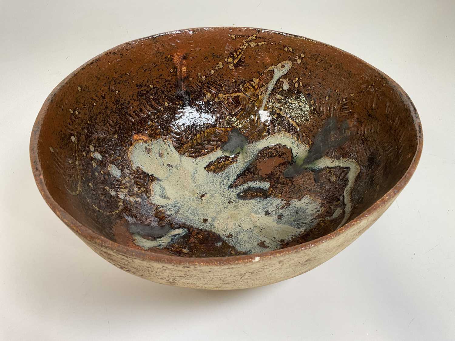 Lot 181 - A studio pottery bowl with brown glaze