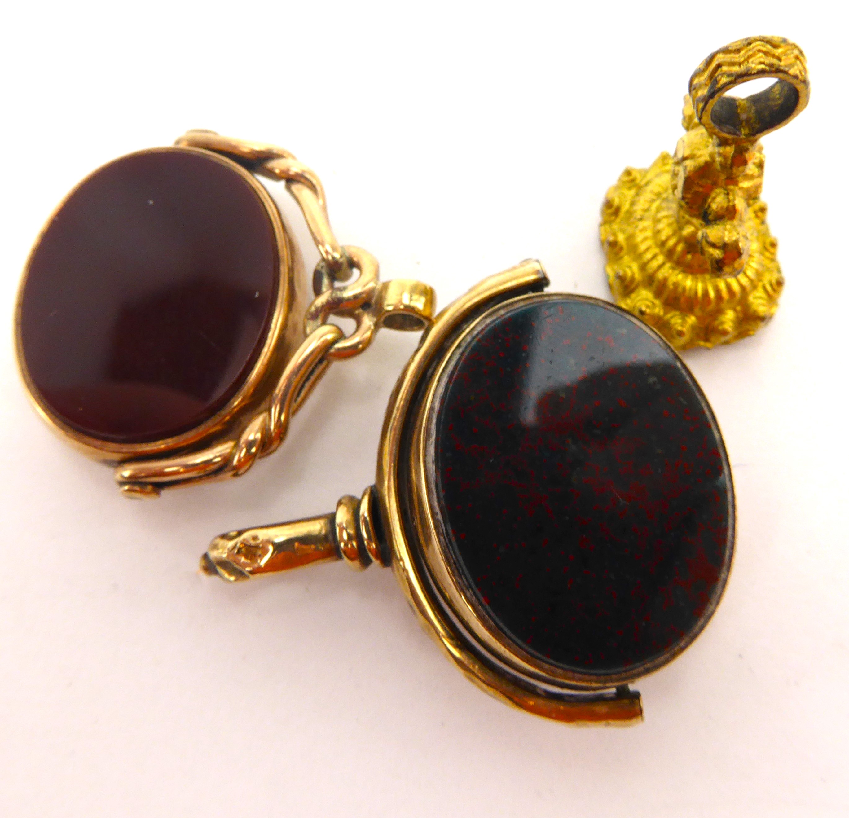 Lot 1111 - Two 19th century 9ct gold swivel fobs, one