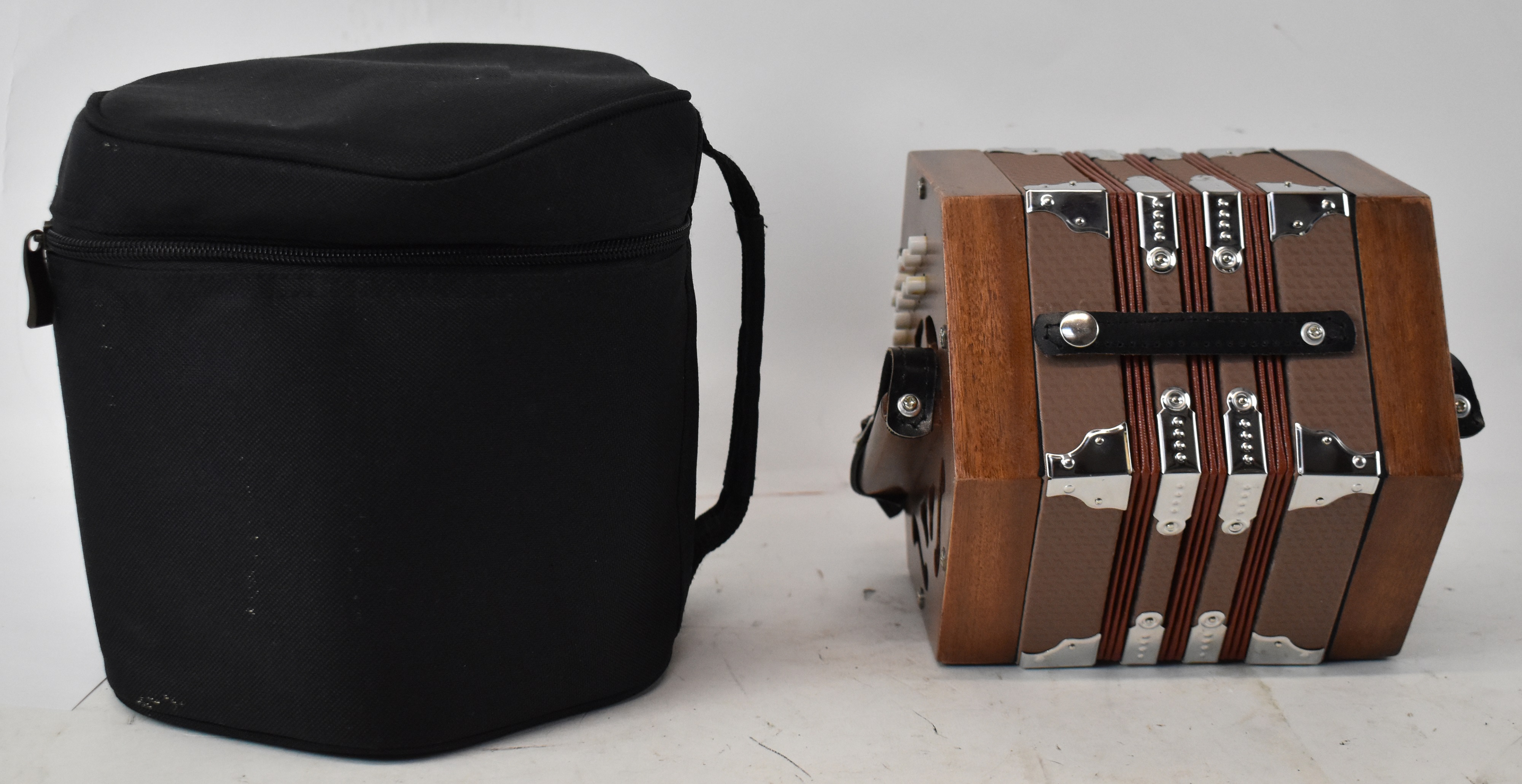 Lot 353 - A modern Hohner twenty-one key concertina,