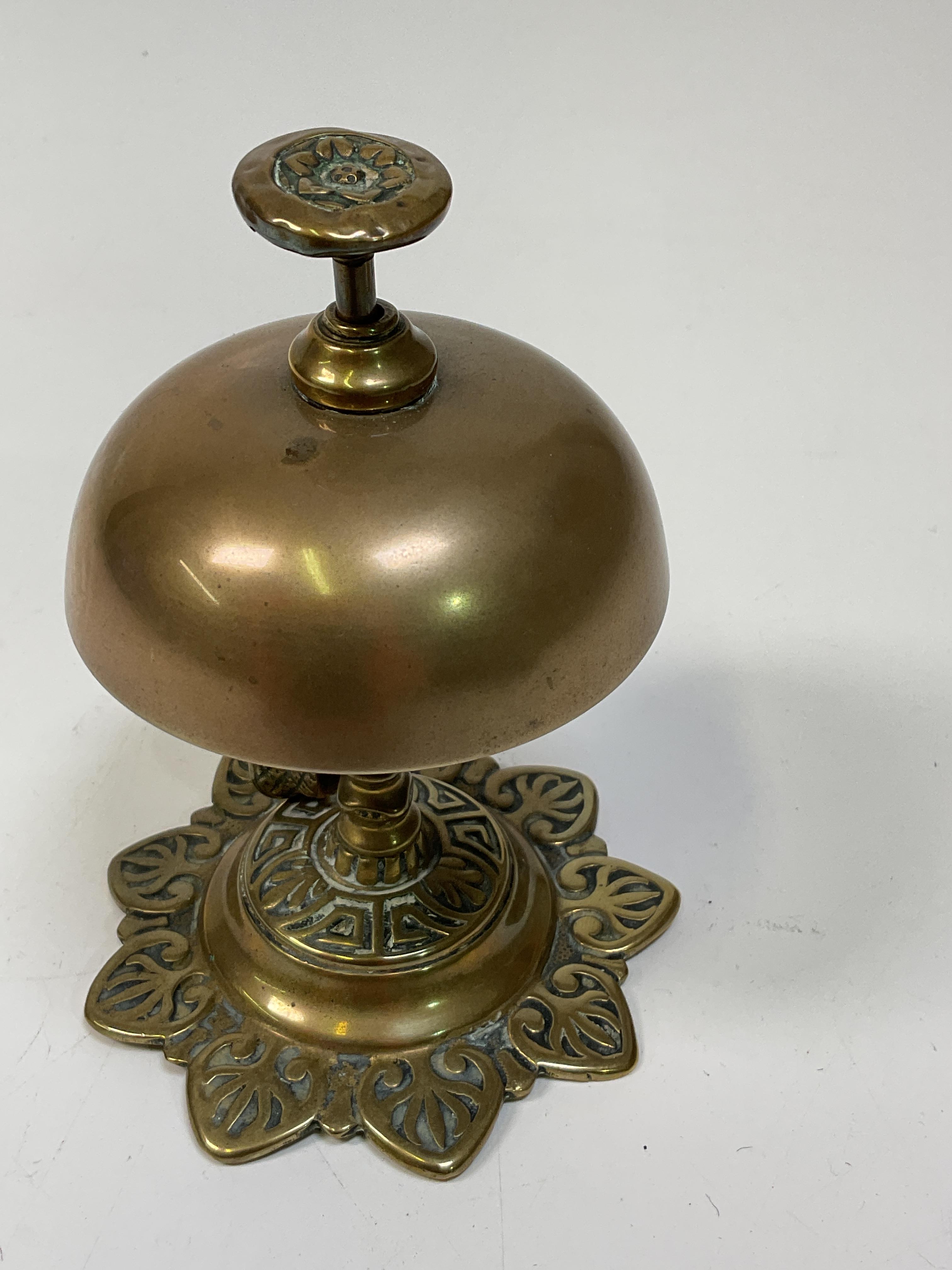 Lot 27 - An early 20th century brass push button bell