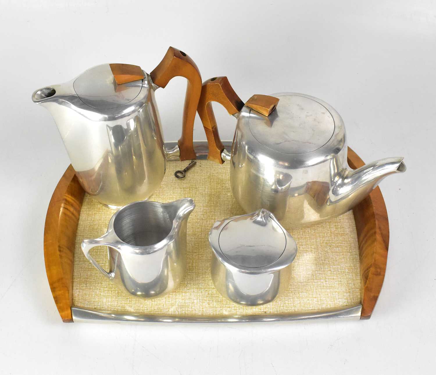 Lot 422 - PIQUOT WARE; a five-piece tea service with