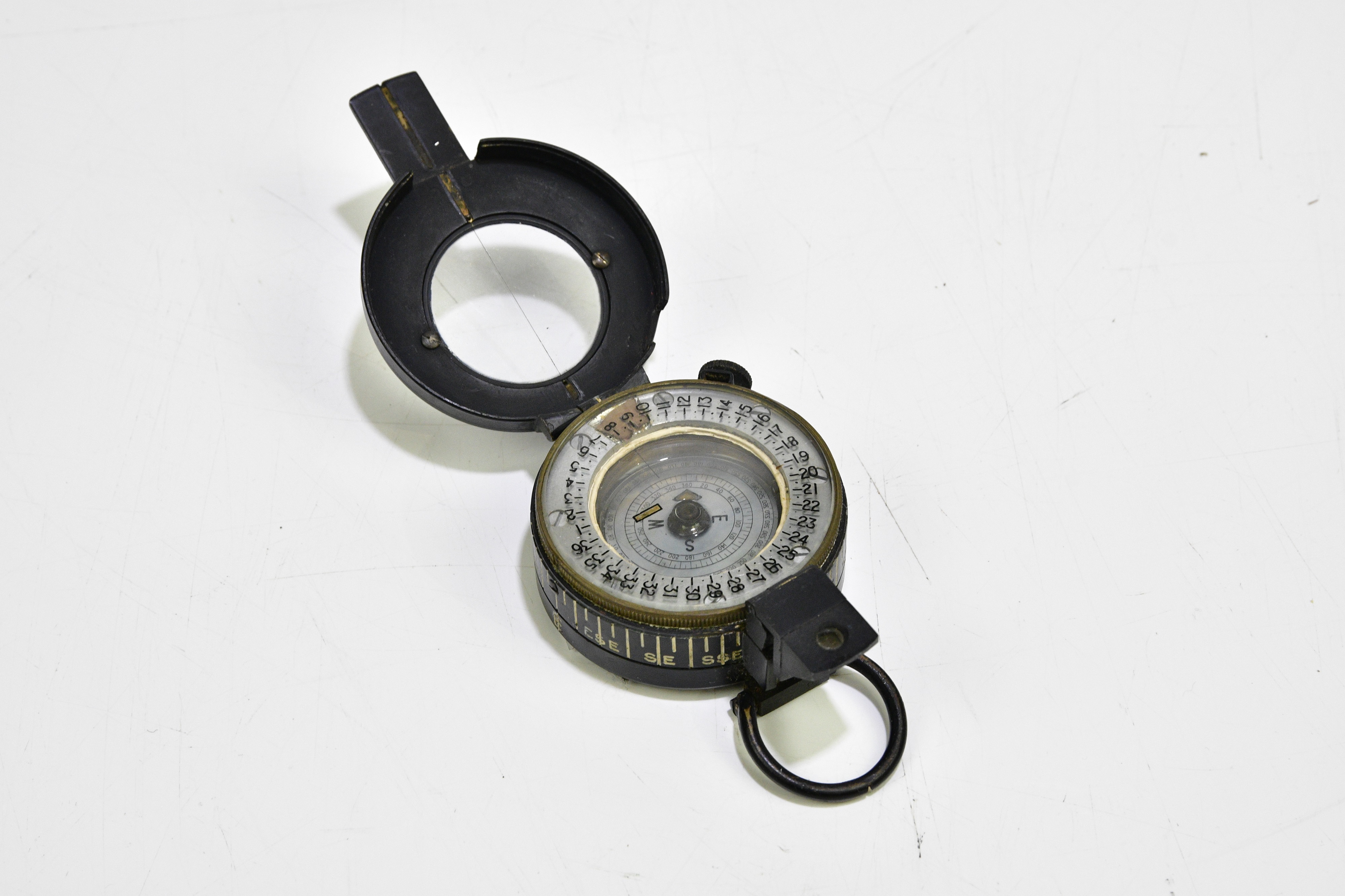 Lot 437 - Two military compasses, one in leather case.