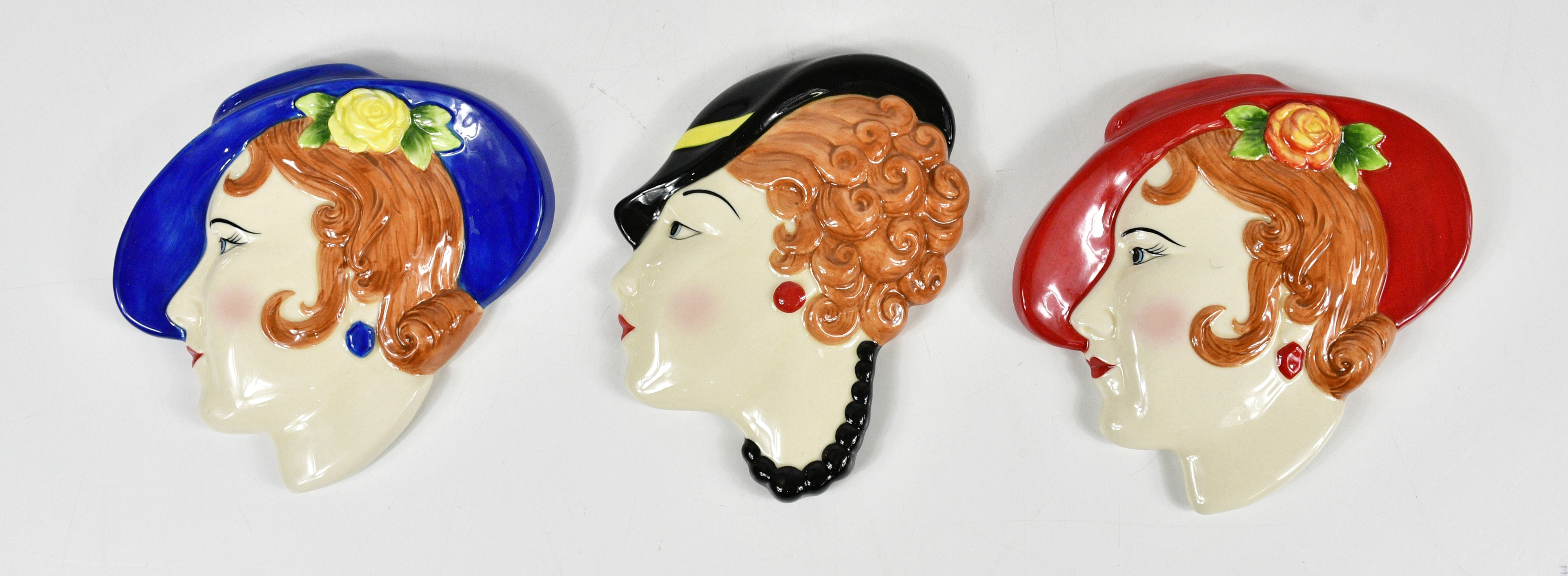 Lot 1511 - MOORLAND POTTERY; three ceramic face