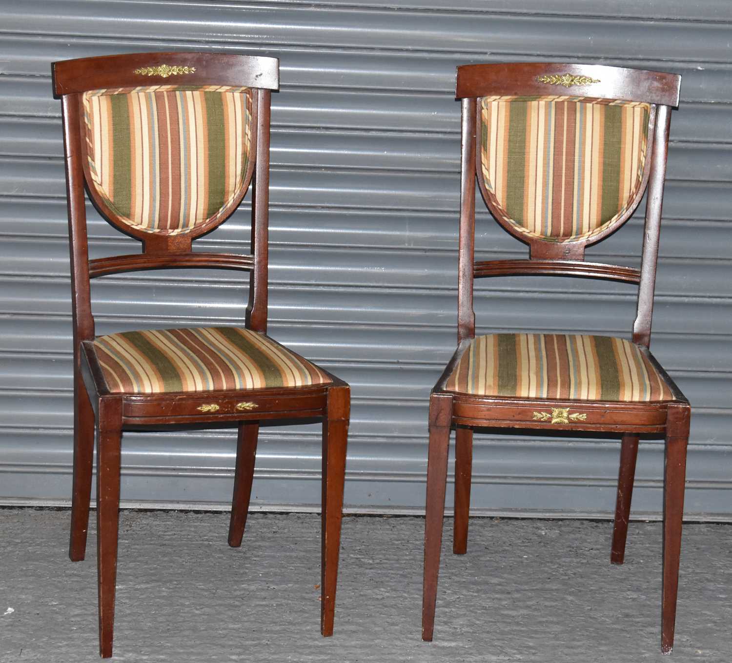 Lot 108 - A pair of Empire style side chairs with gilt
