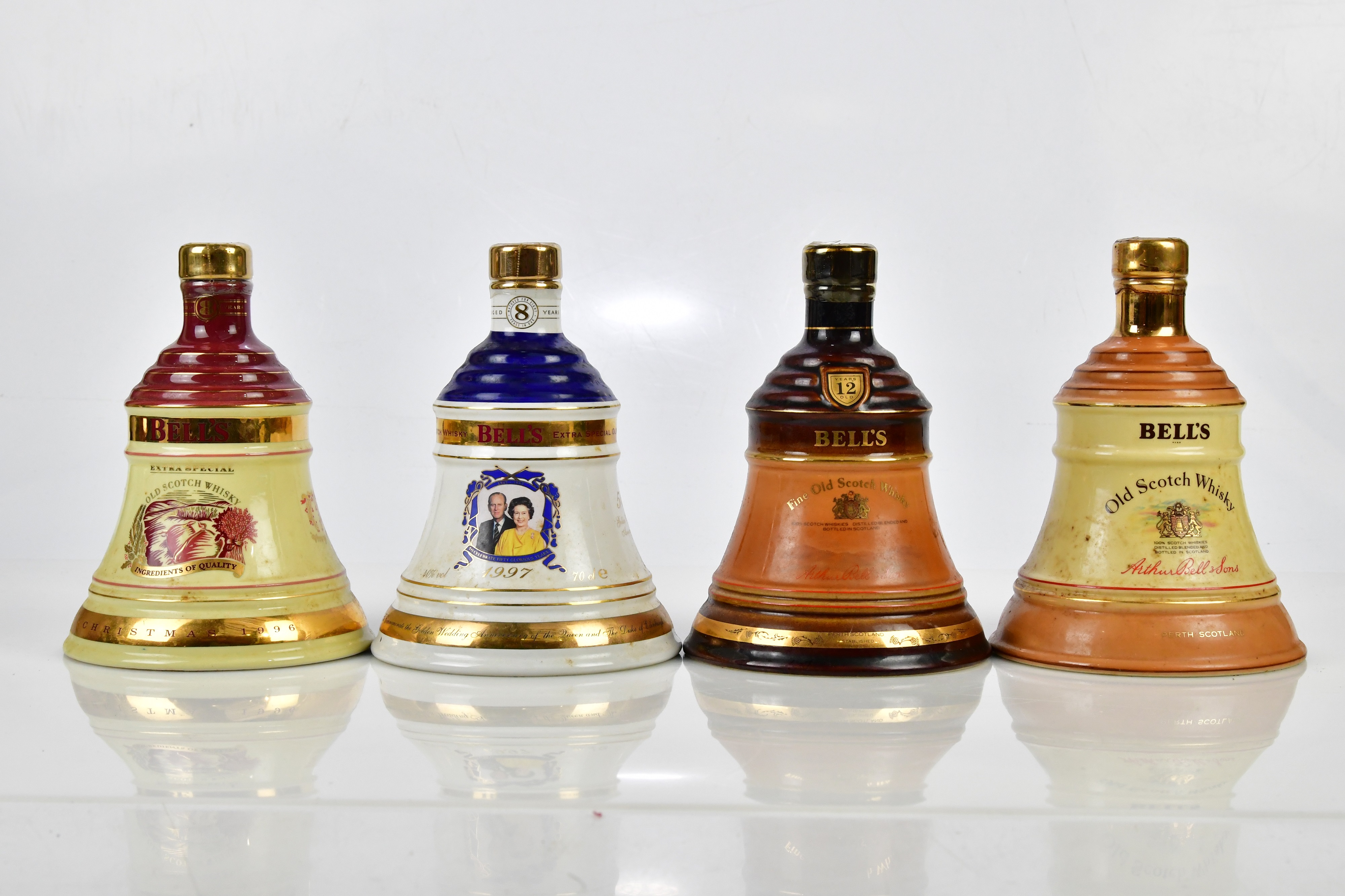 Lot 4064 - WHISKY; four Wade Ceramic Decanters to
