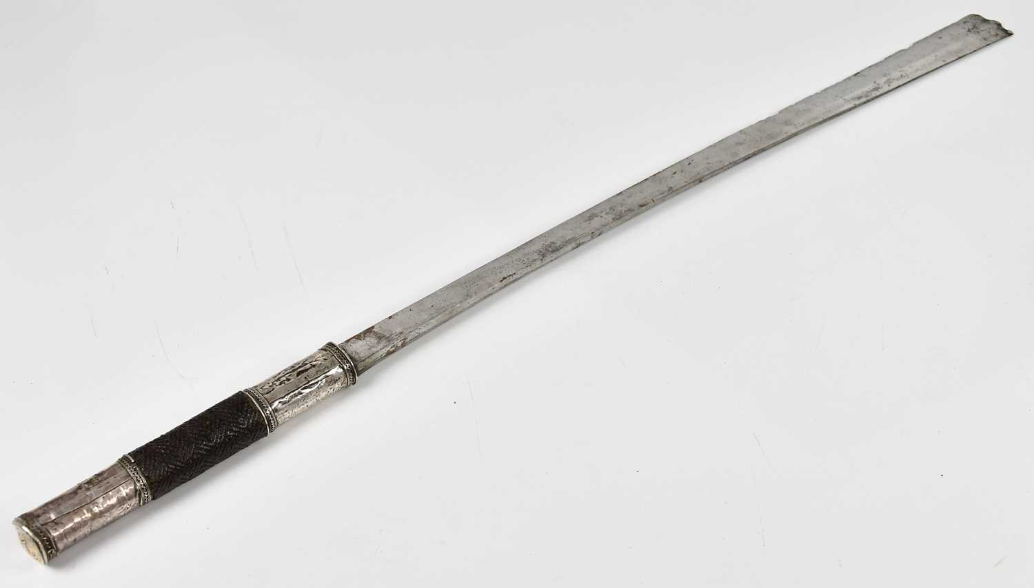 Lot 699 - An Indian Naga sword with white metal handle