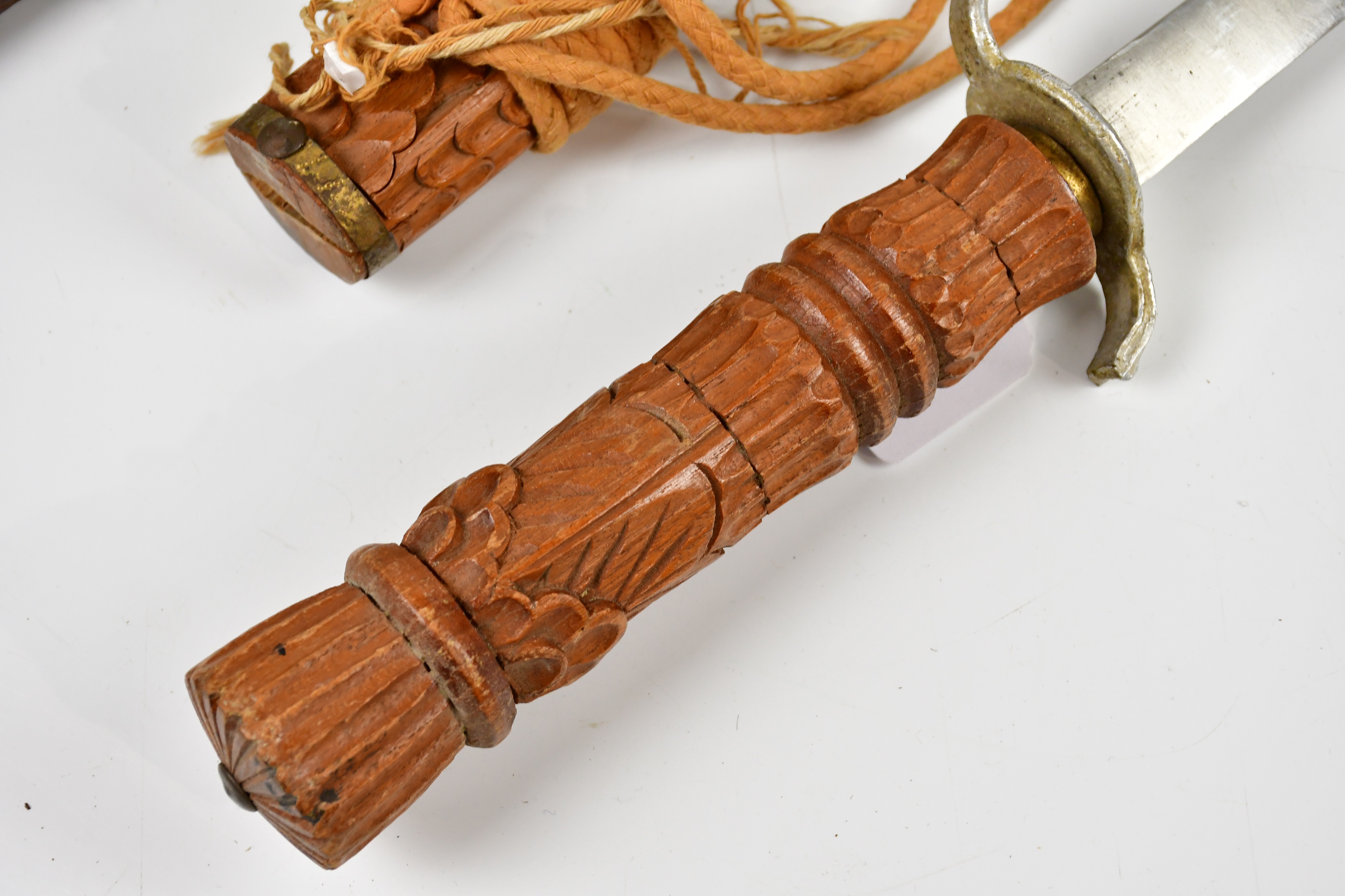 Lot 727 - An Indian sword with brass handle and carved