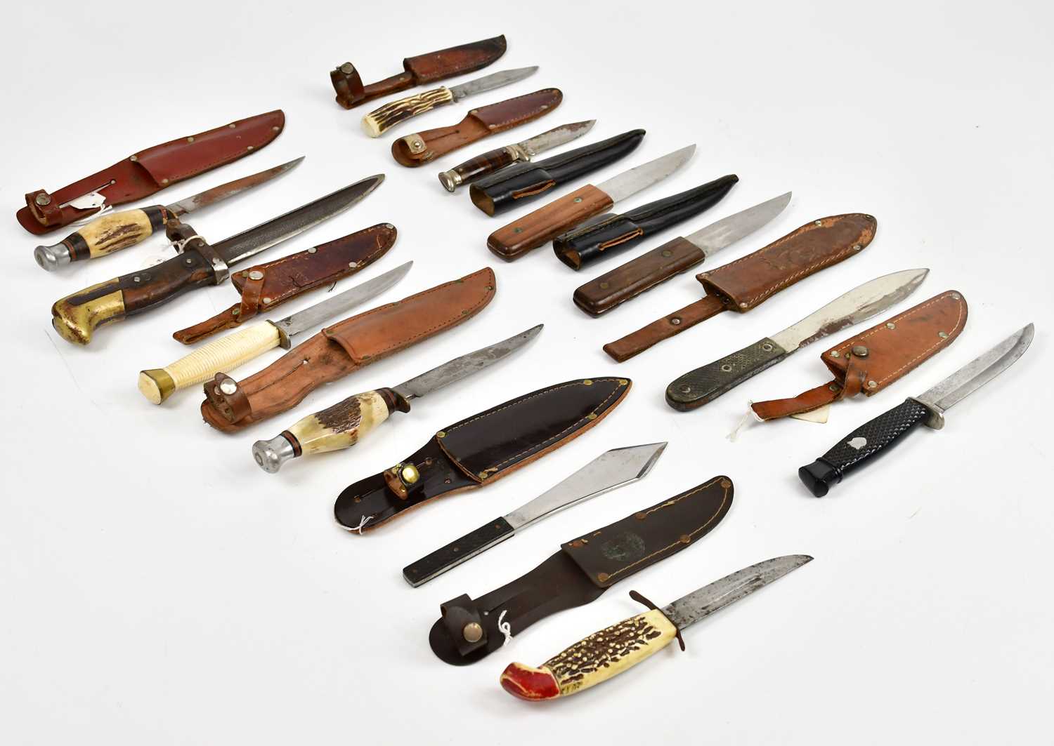 Lot 717 - A collection of military and other knives,