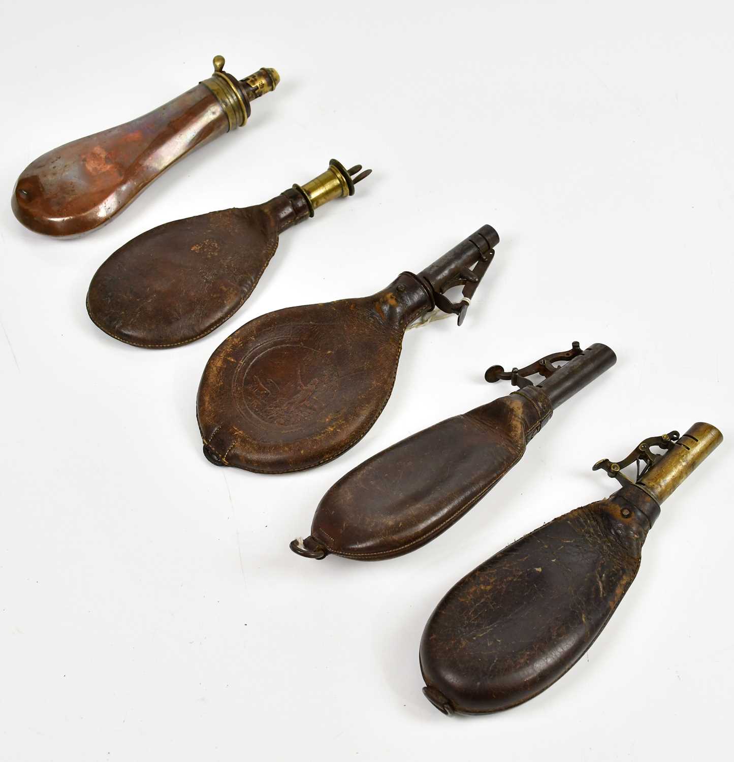 Lot 430 - A collection of powder flasks, including a