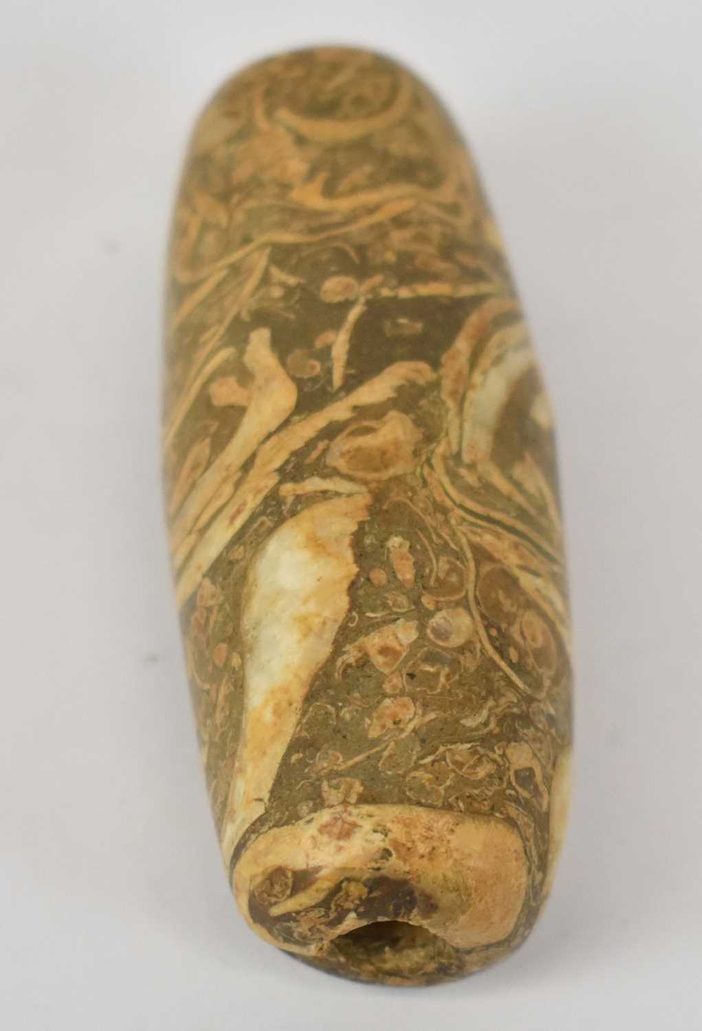 Lot 293 - An ancient Persian hardstone bead, length