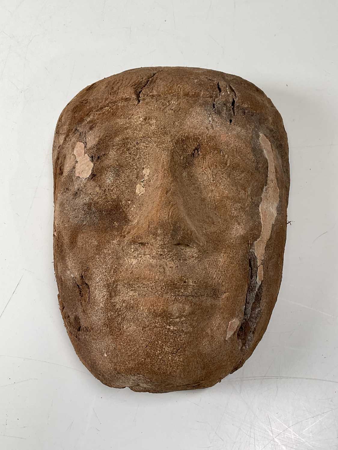 Lot 5 - A carved wooden Egyptian mask, height 23cm.
