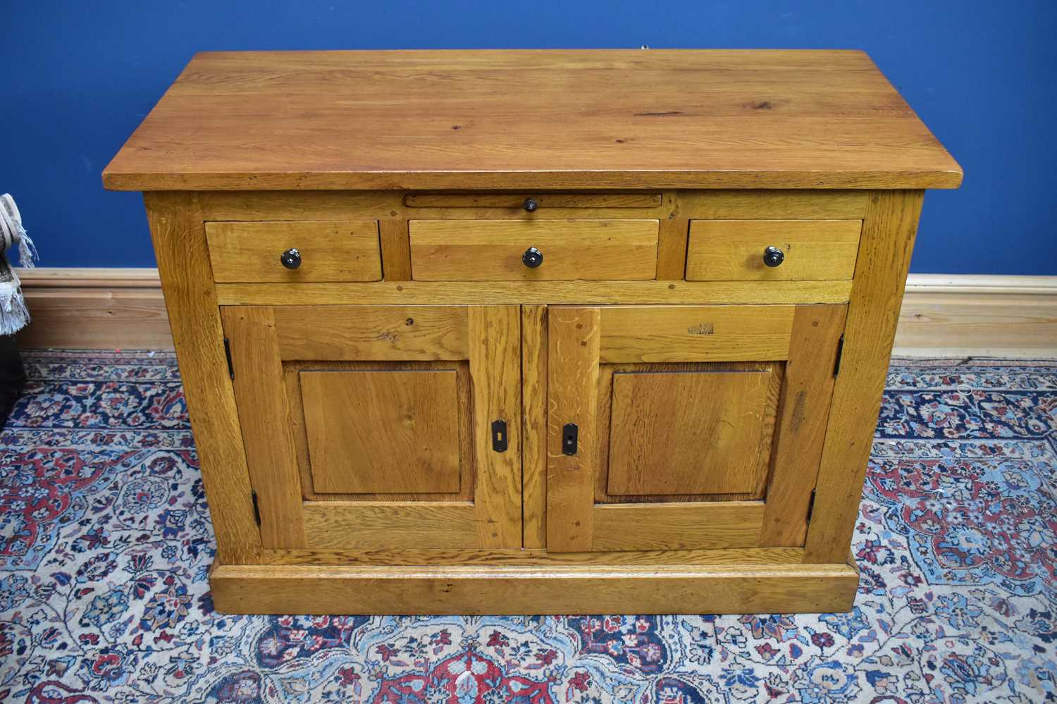Lot 2683 - A reproduction oak sideboard, with slide