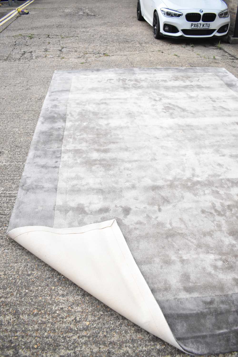 Lot 152 - A very large modern grey ground carpet,