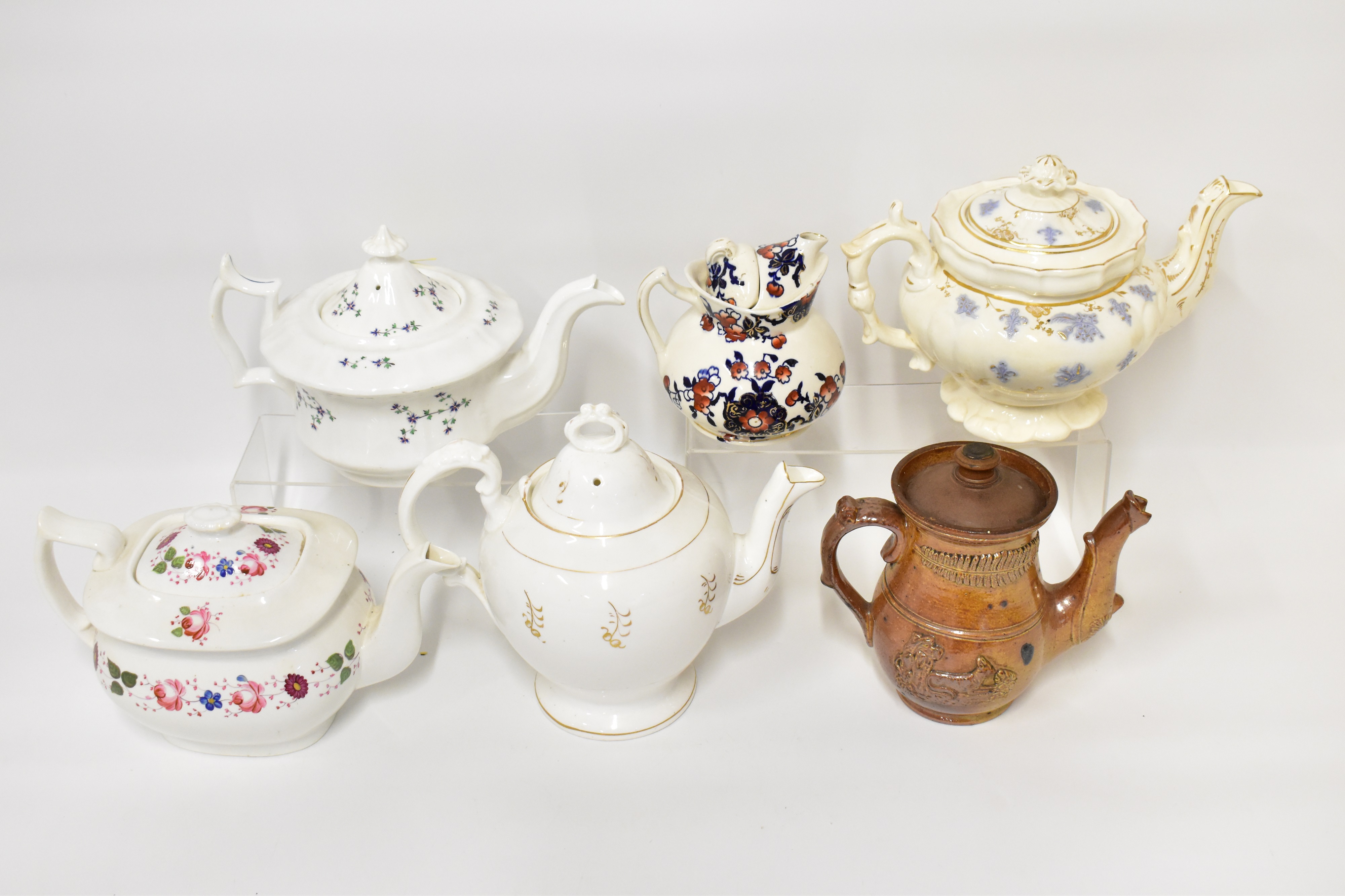 Lot 541 - Six Victorian pottery teapots, to include