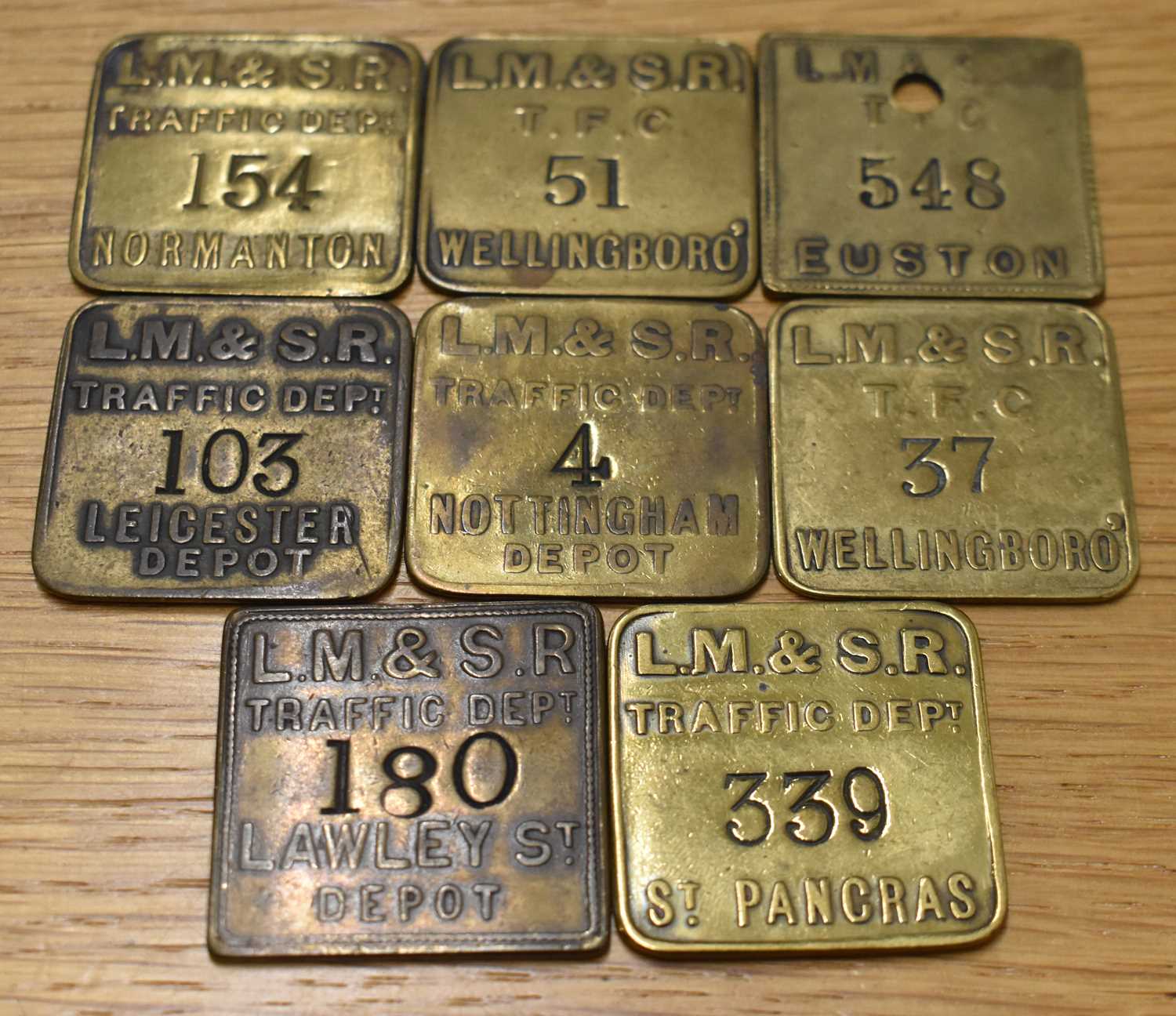 Lot 247 - LM& six assorted tokens/tallies.