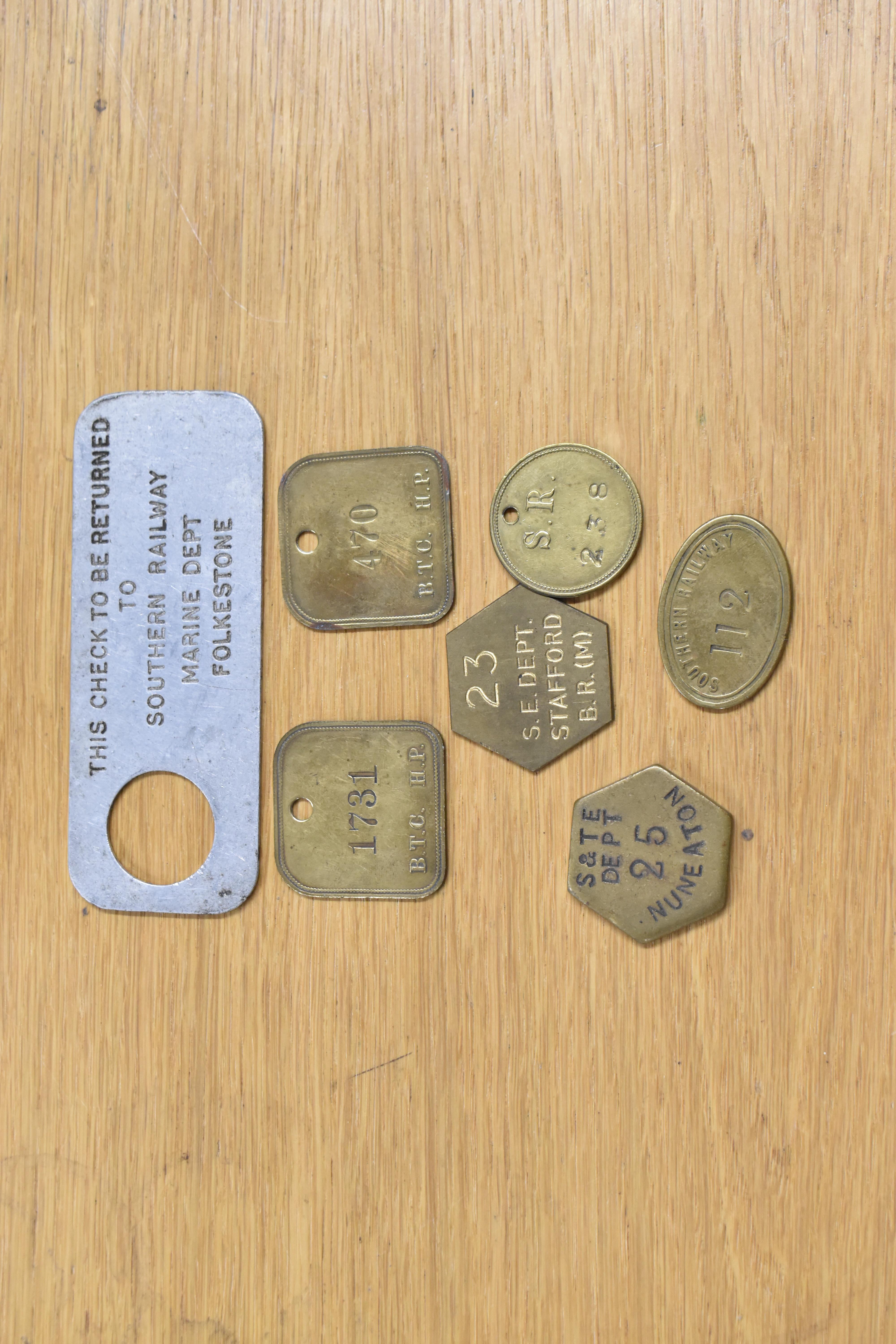 Lot 270 - Six assorted brass railway tokens/tallies