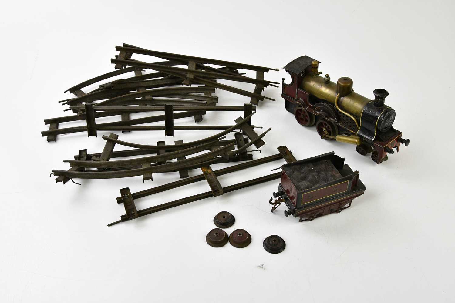 Lot 4342 - A clockwork locomotive with assorted track