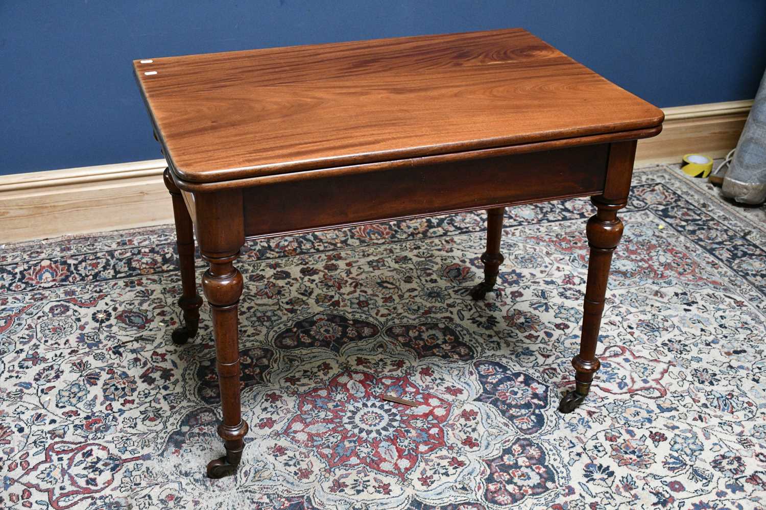 Lot 2387 - A Victorian fold over table on turned