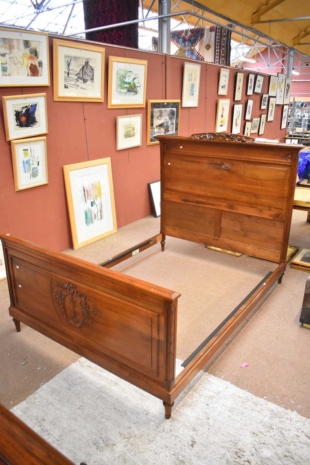 Lot 6747 - A mahogany floral carved bed, height 146cm,