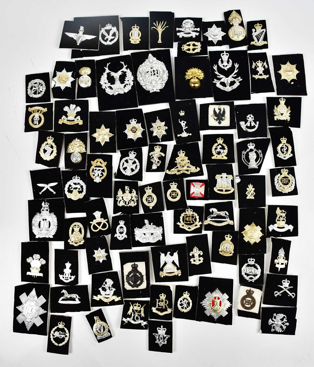 Lot 457 - A large collection of Staybrite cap badges,