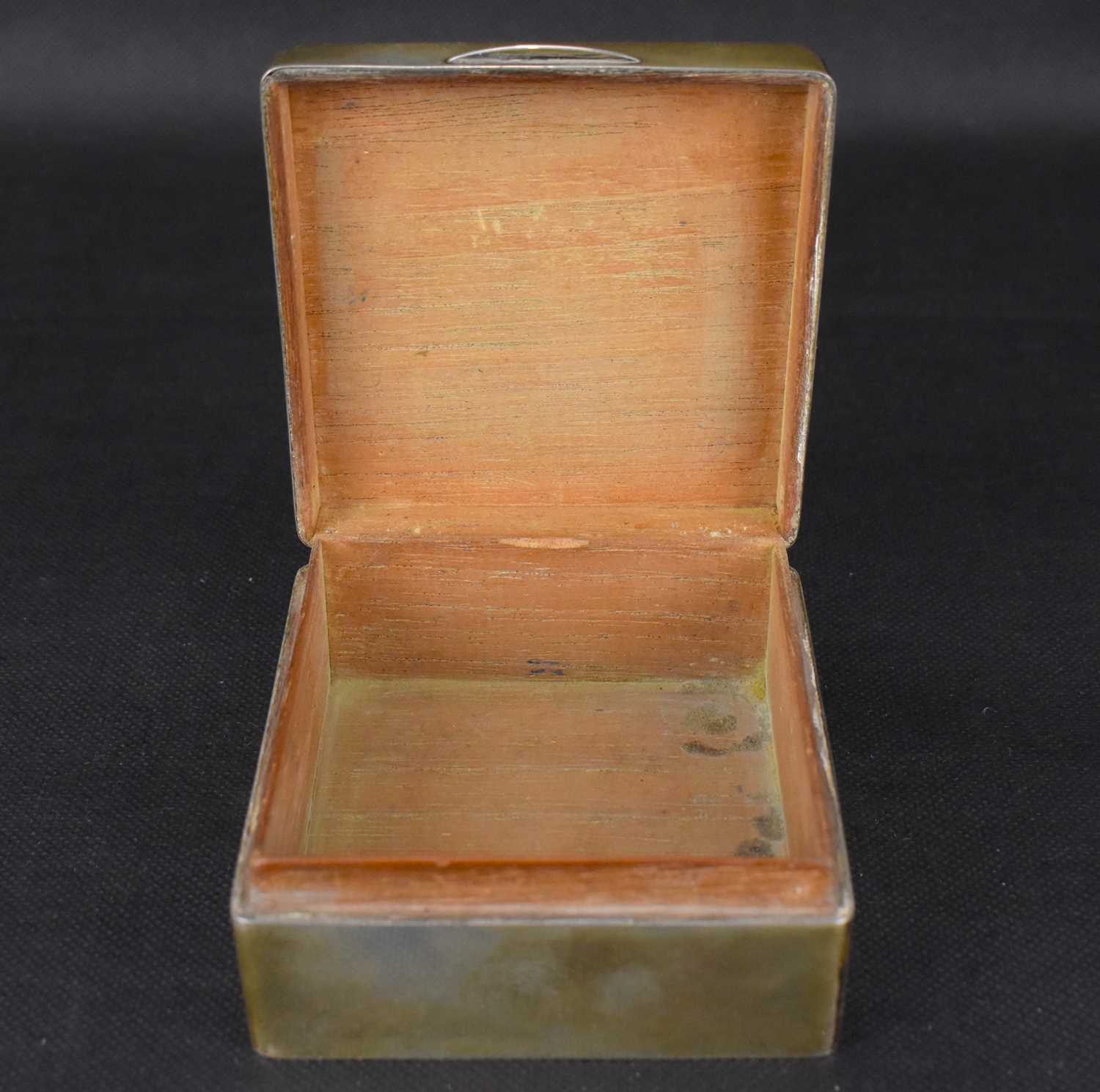 Lot 660 - A hallmarked silver cased square cigarette