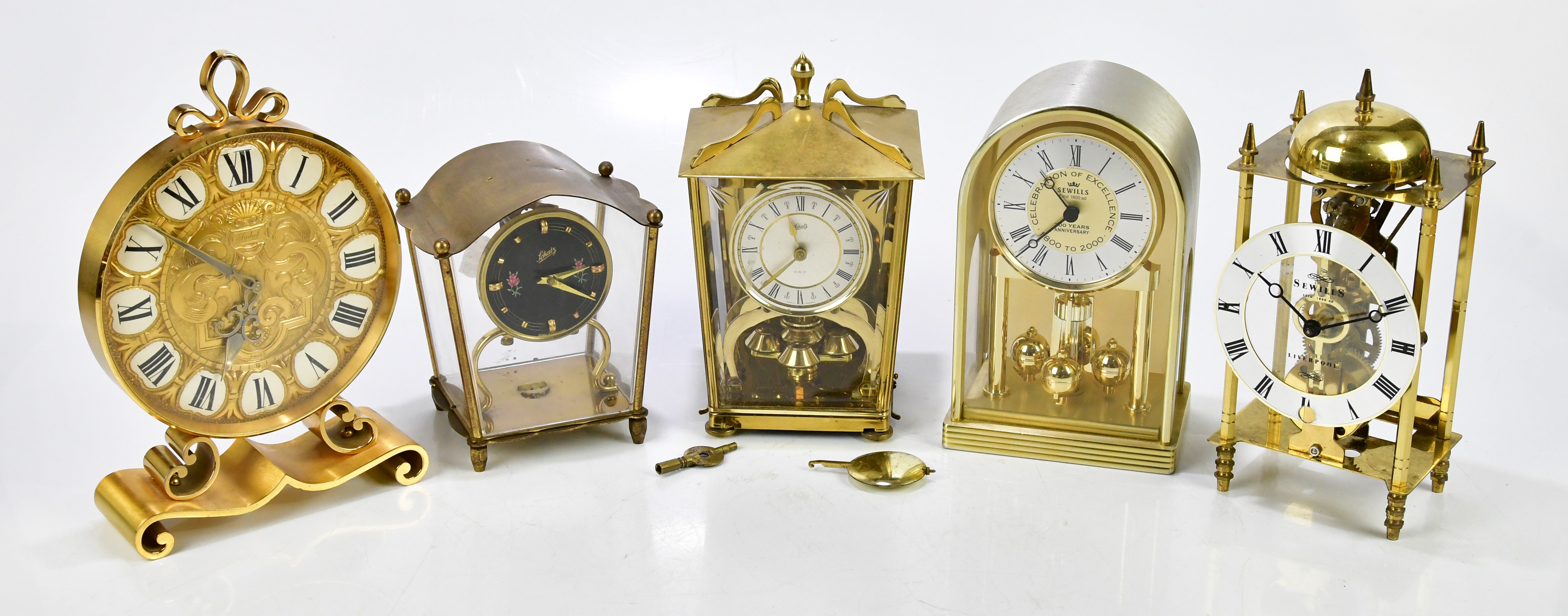 Lot 2306 - A group of five modern brass mantel clocks,