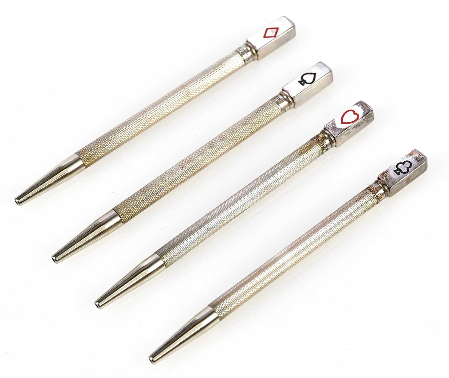 Lot 2547 - Four sterling silver bridge pencils with