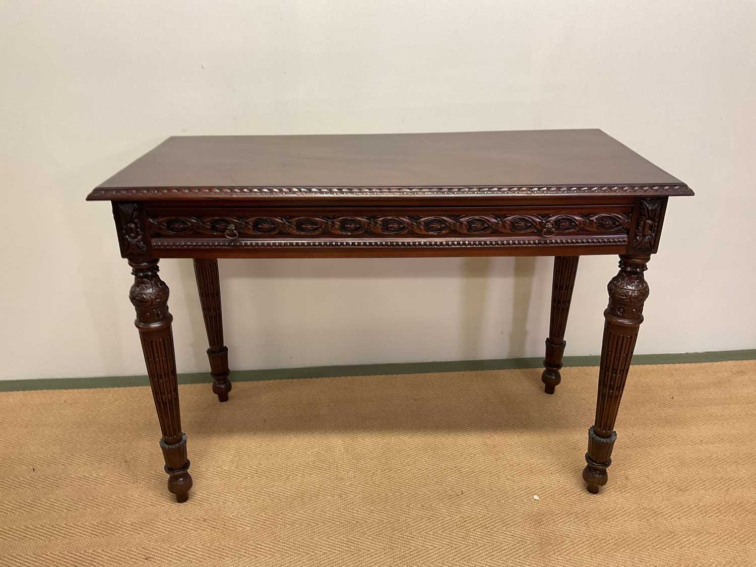 Lot 788 - A reproduction hall table with carved detail,