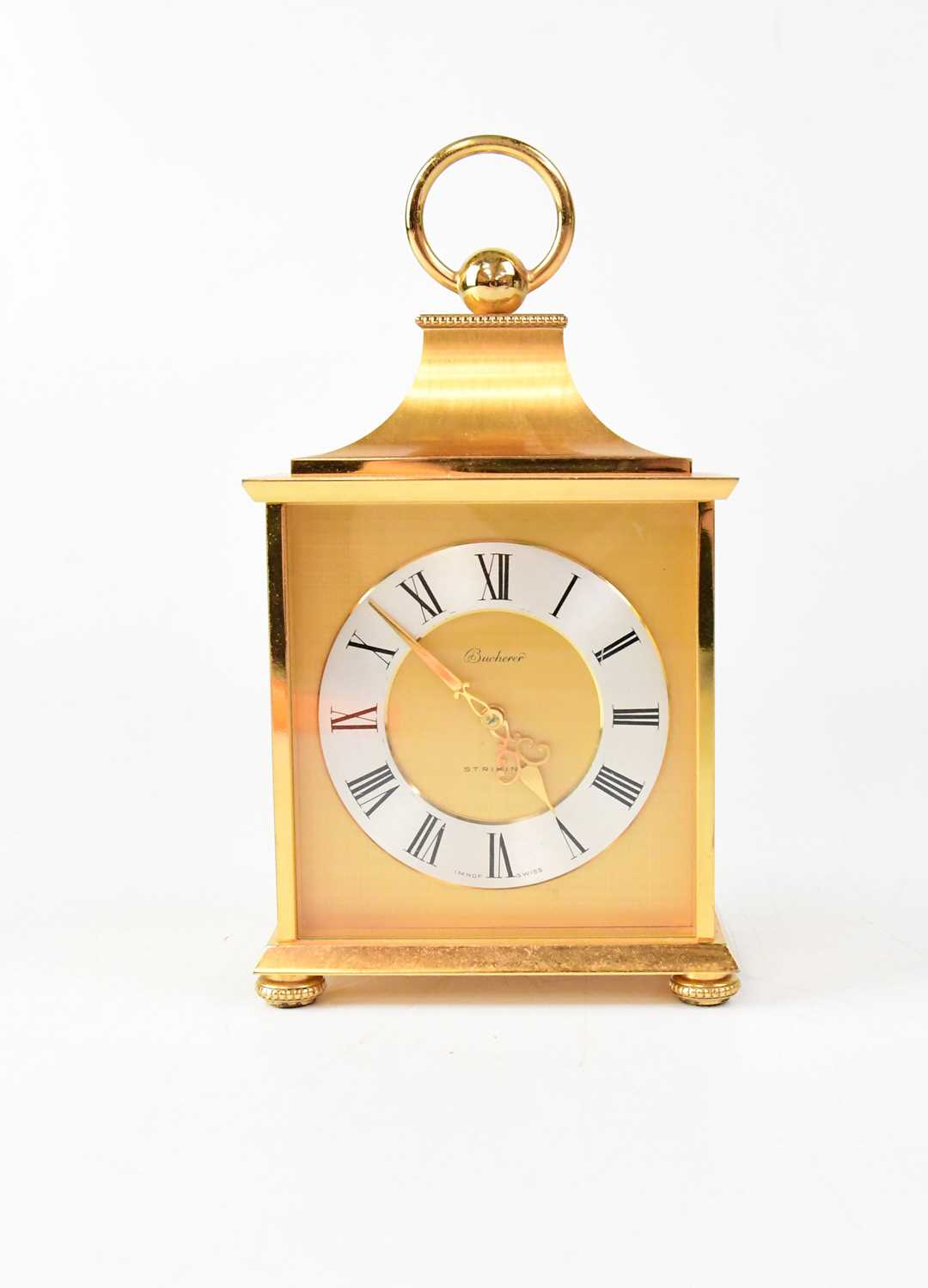 Lot 117 - BUCHERER; a brass cased carriage-type clock,