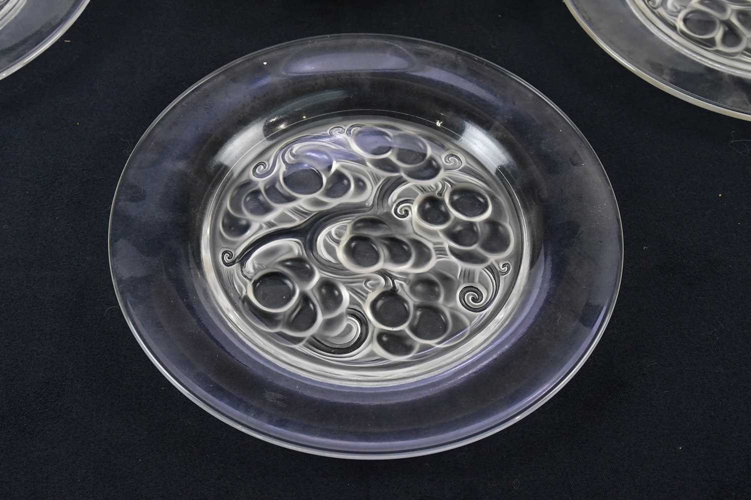 Lot 255 - RENE LALIQUE; three clear glass plates in
