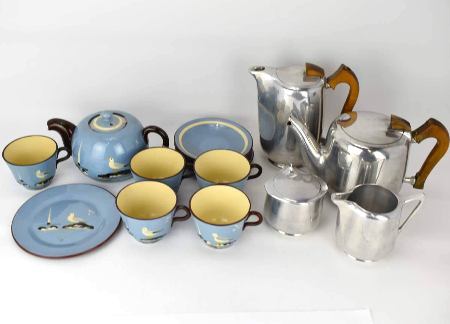 Lot 142 - PICQUOT WARE; a four-piece tea set