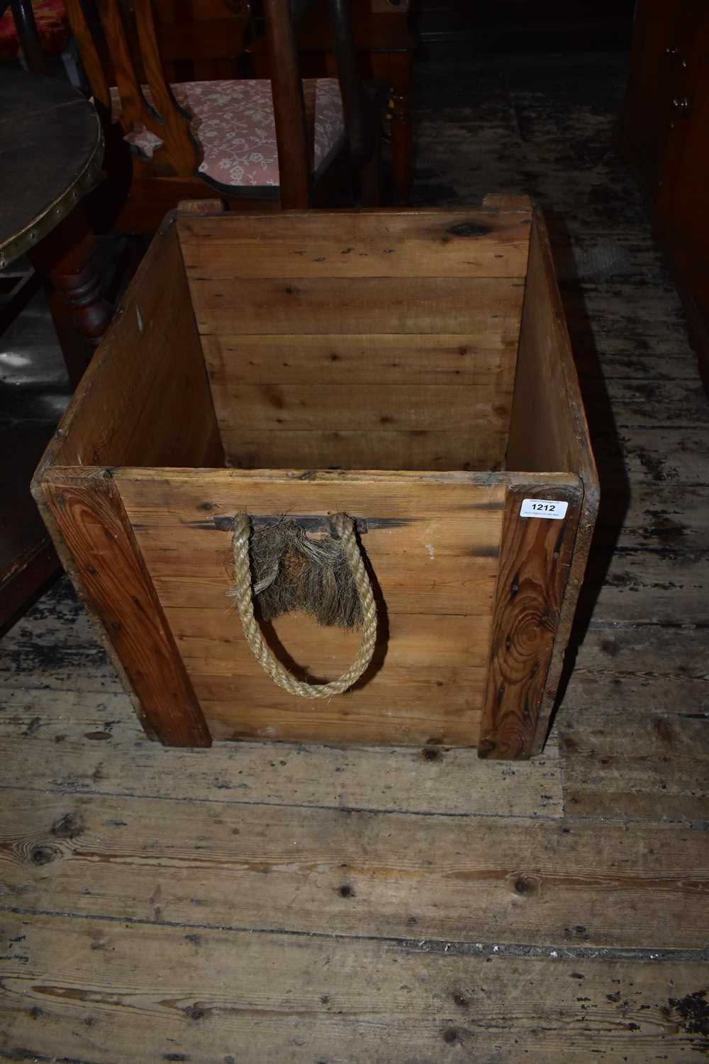 Lot 1212 - A modern pine storage box with rope handles,
