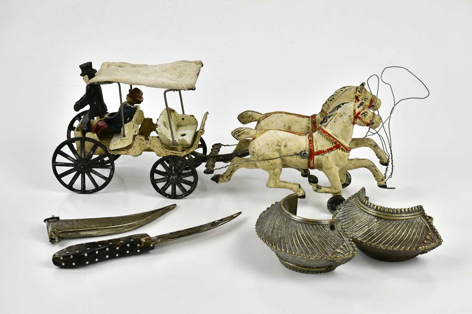 Lot 410 - An unusual cast metal model of figures on a