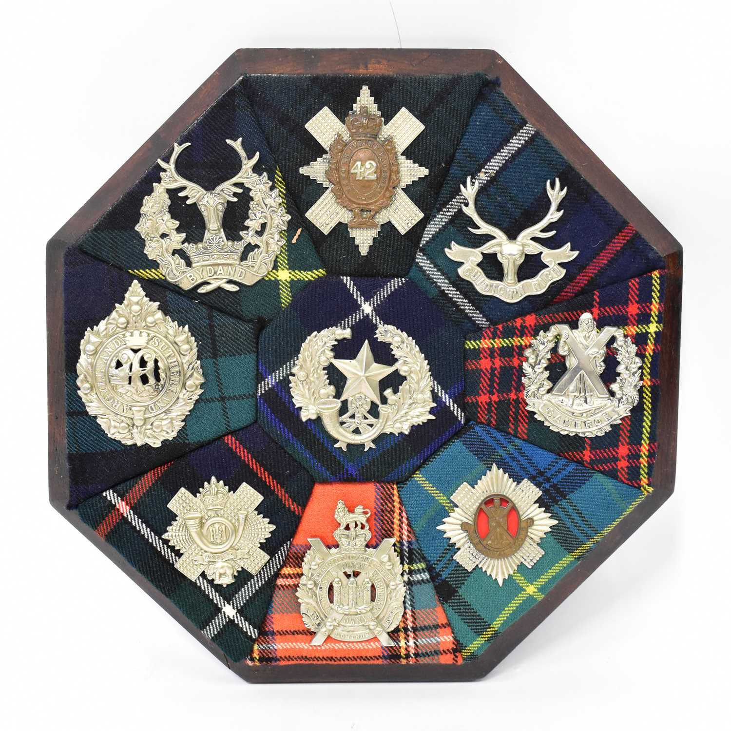 Lot 476 - An octagonal oak plaque bearing the cap